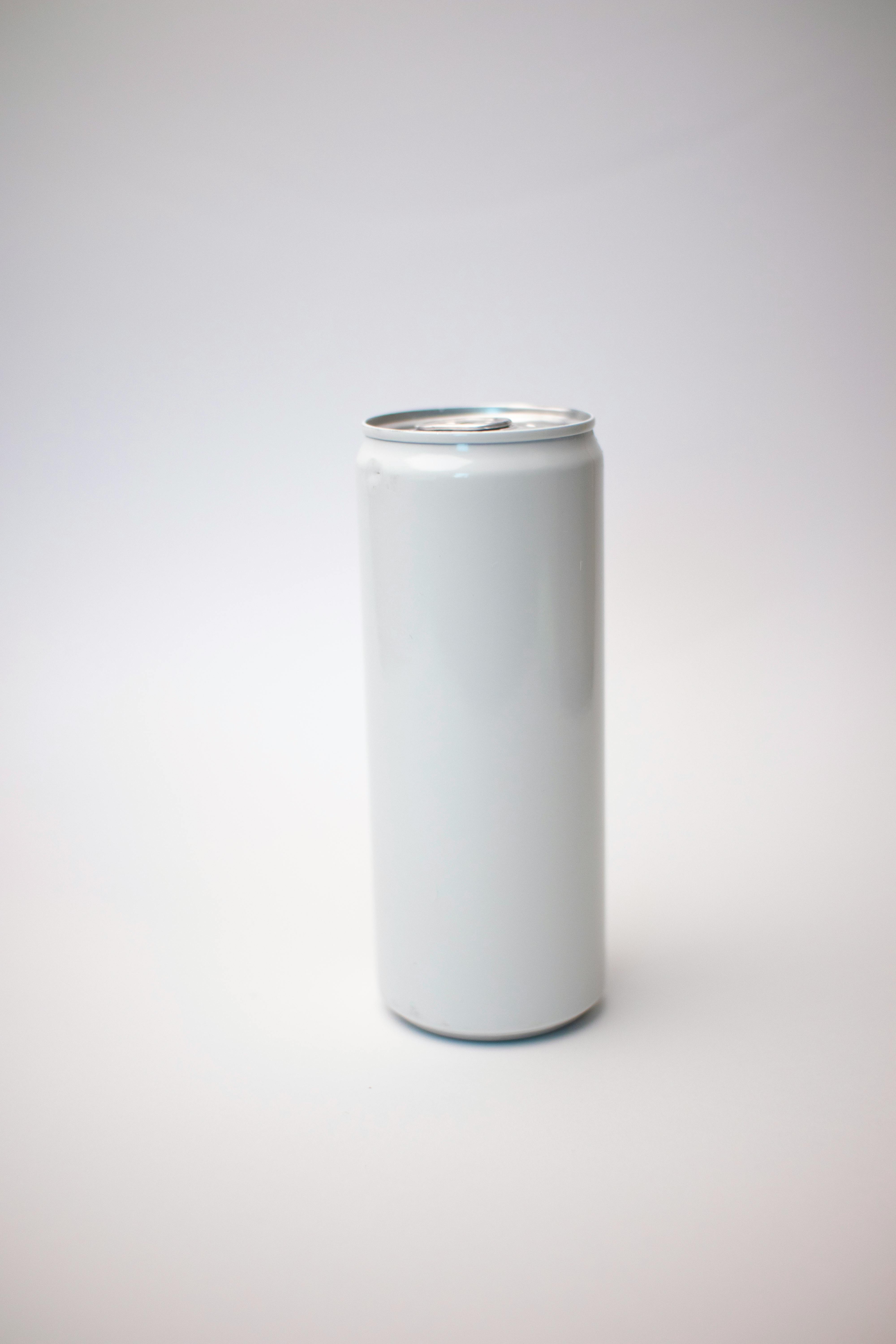White Cans in White Surface · Free Stock Photo