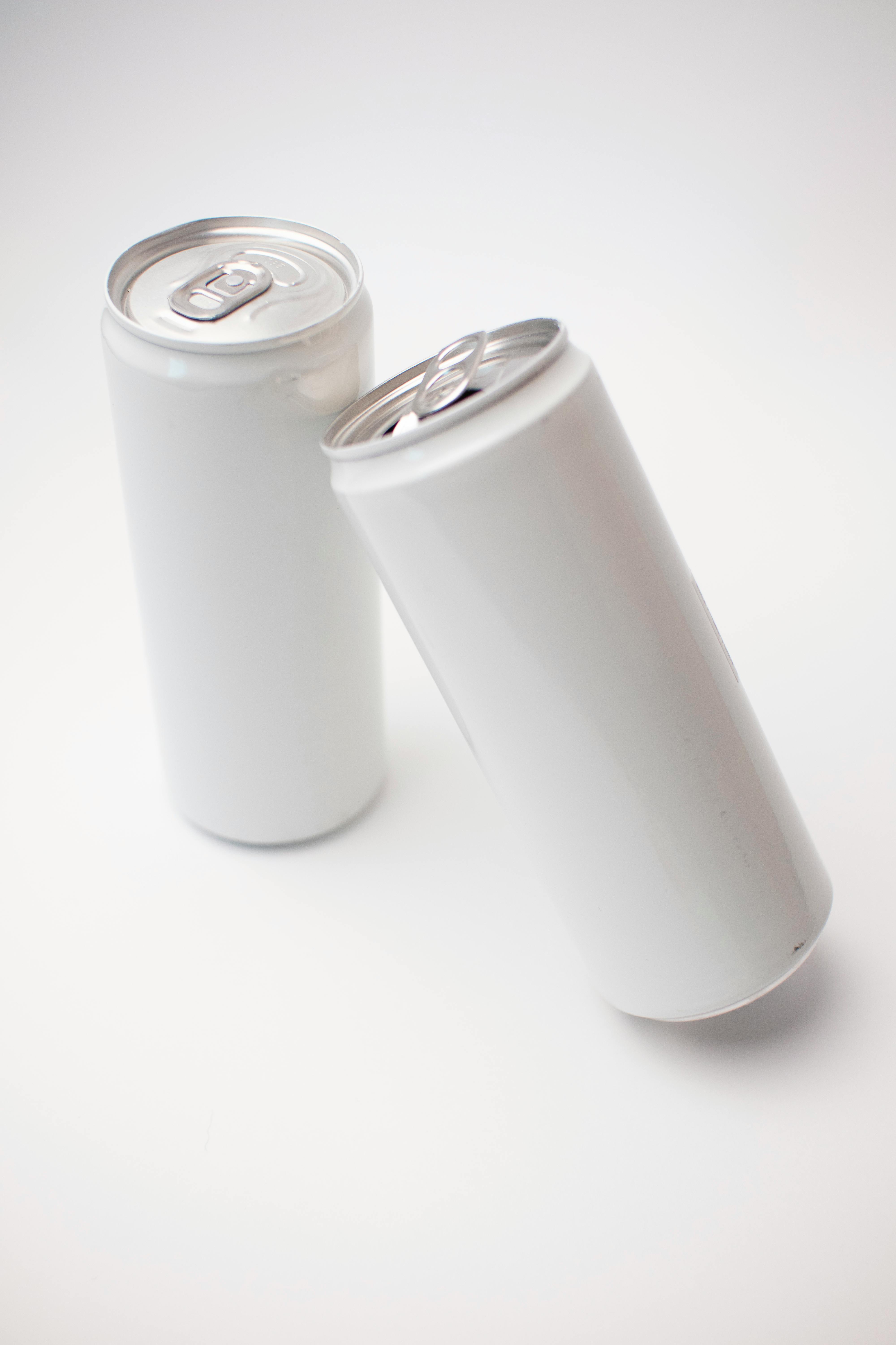 White Cans in White Surface · Free Stock Photo