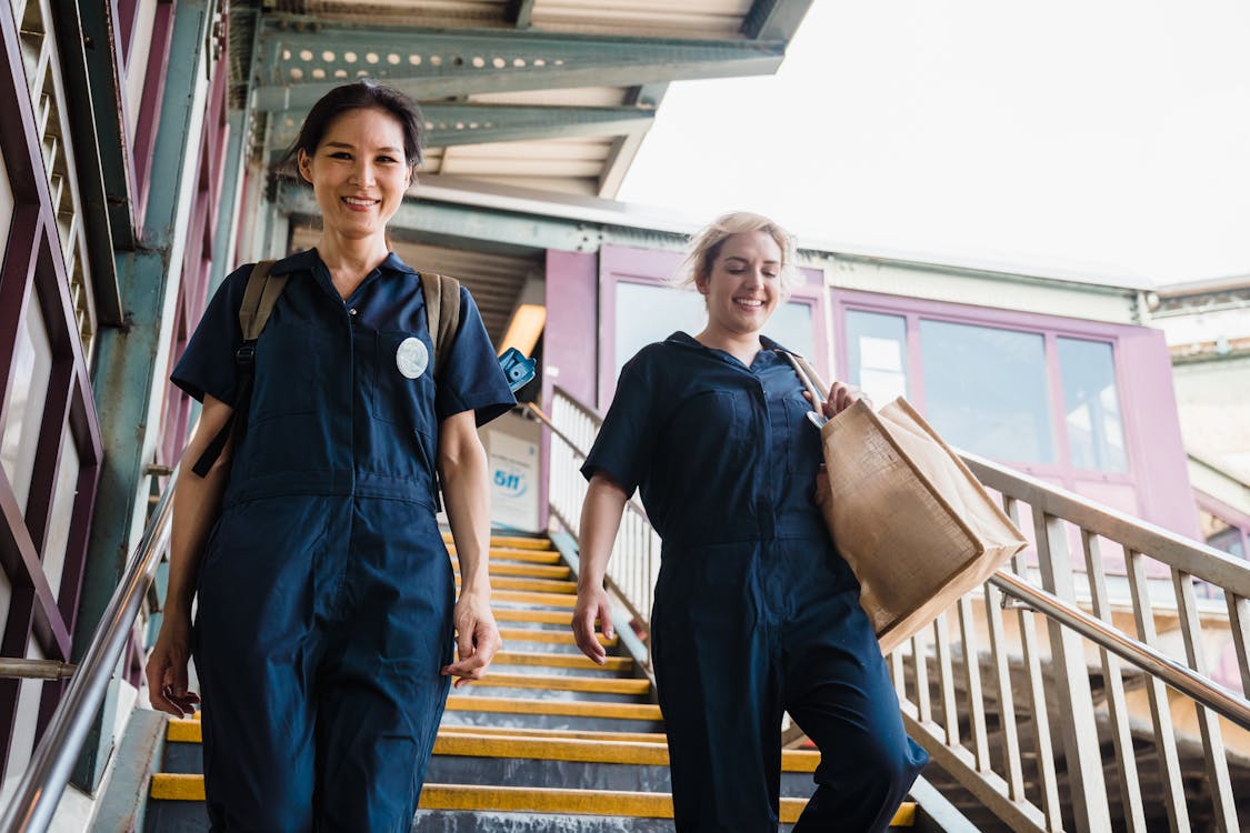 Two Women Walking down the Stairs · Free Stock Photo Two Women Walking down the Stairs · Free Stock Photo