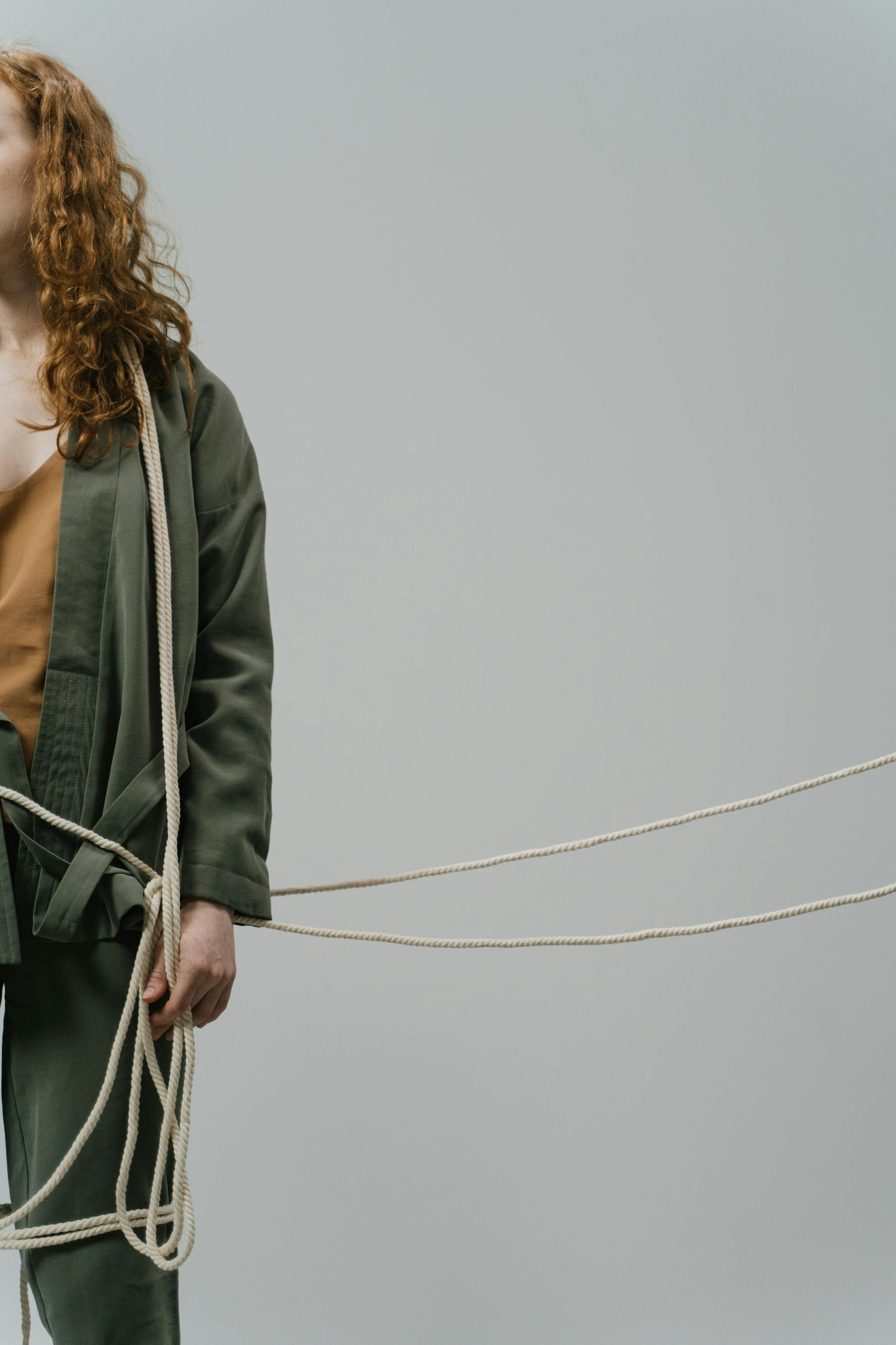 Conceptual Photo of a Woman Tied with a Rope · Free Stock Photo
