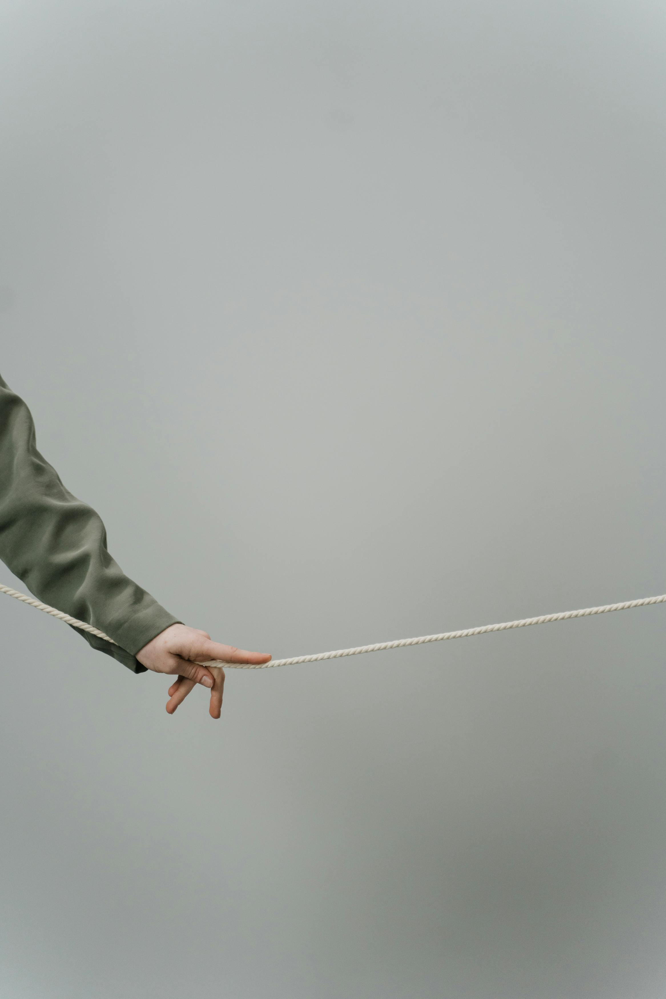 A Person Holding a Rope · Free Stock Photo