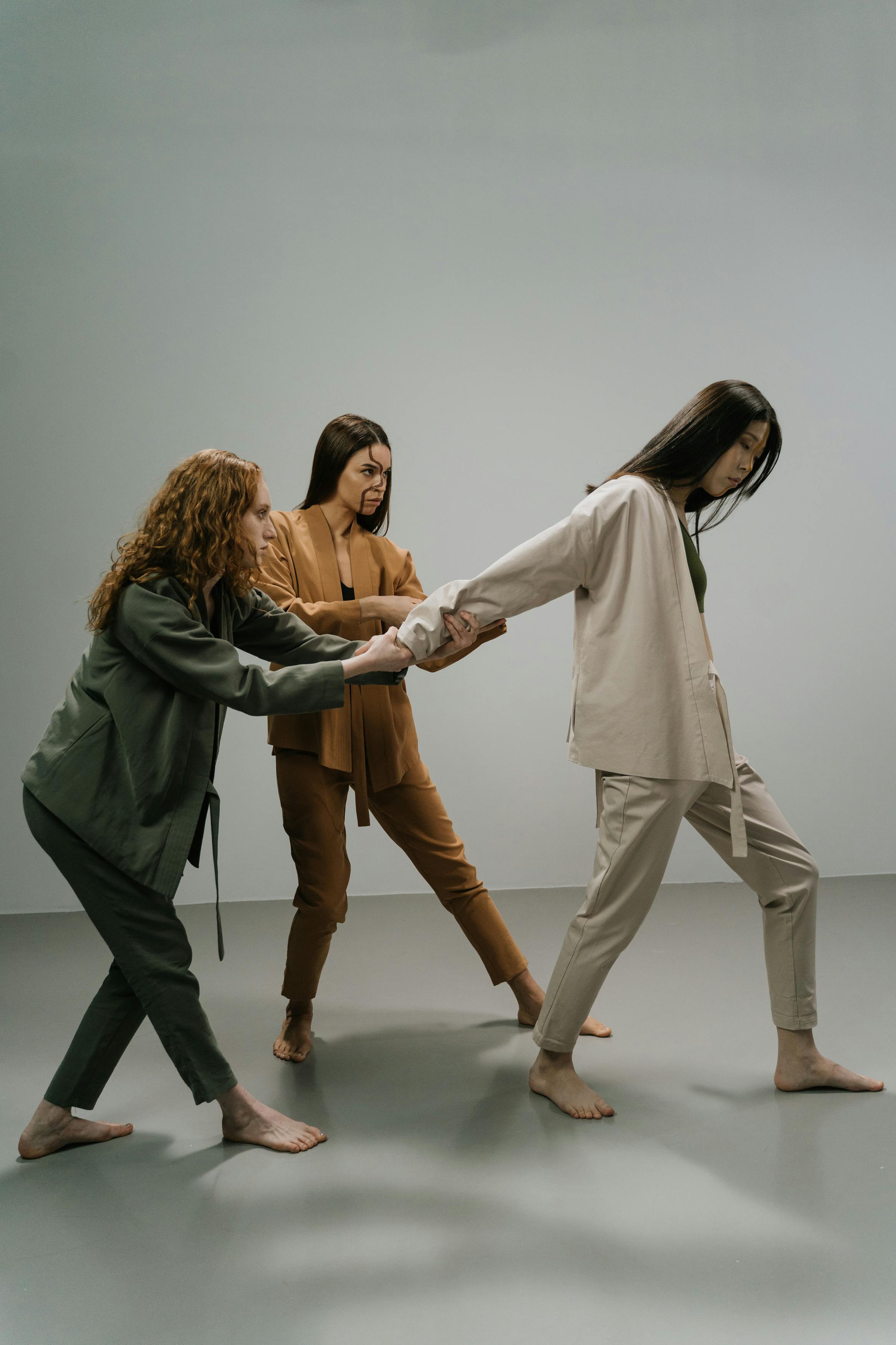 Women Standing Inside the Gray Room · Free Stock Photo