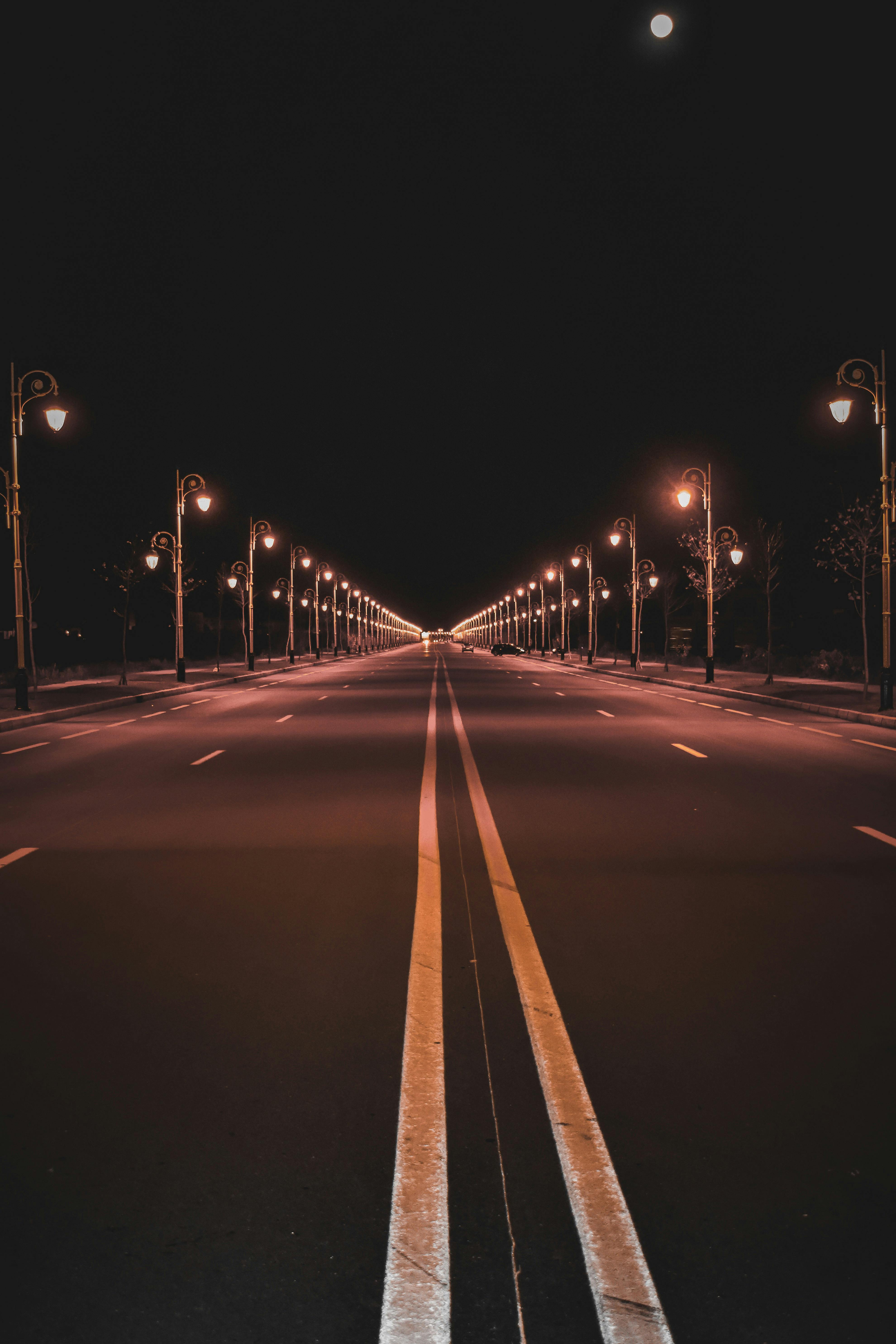 An Empty Road During Night Time · Free Stock Photo