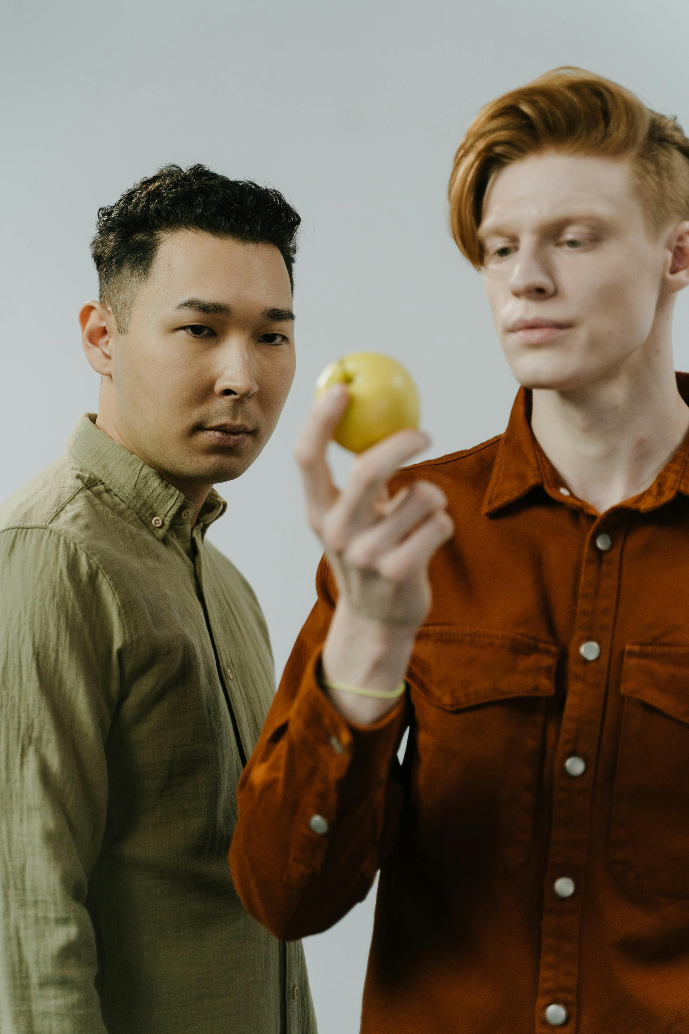 Portrait of Men with Grapefruit · Free Stock Photo