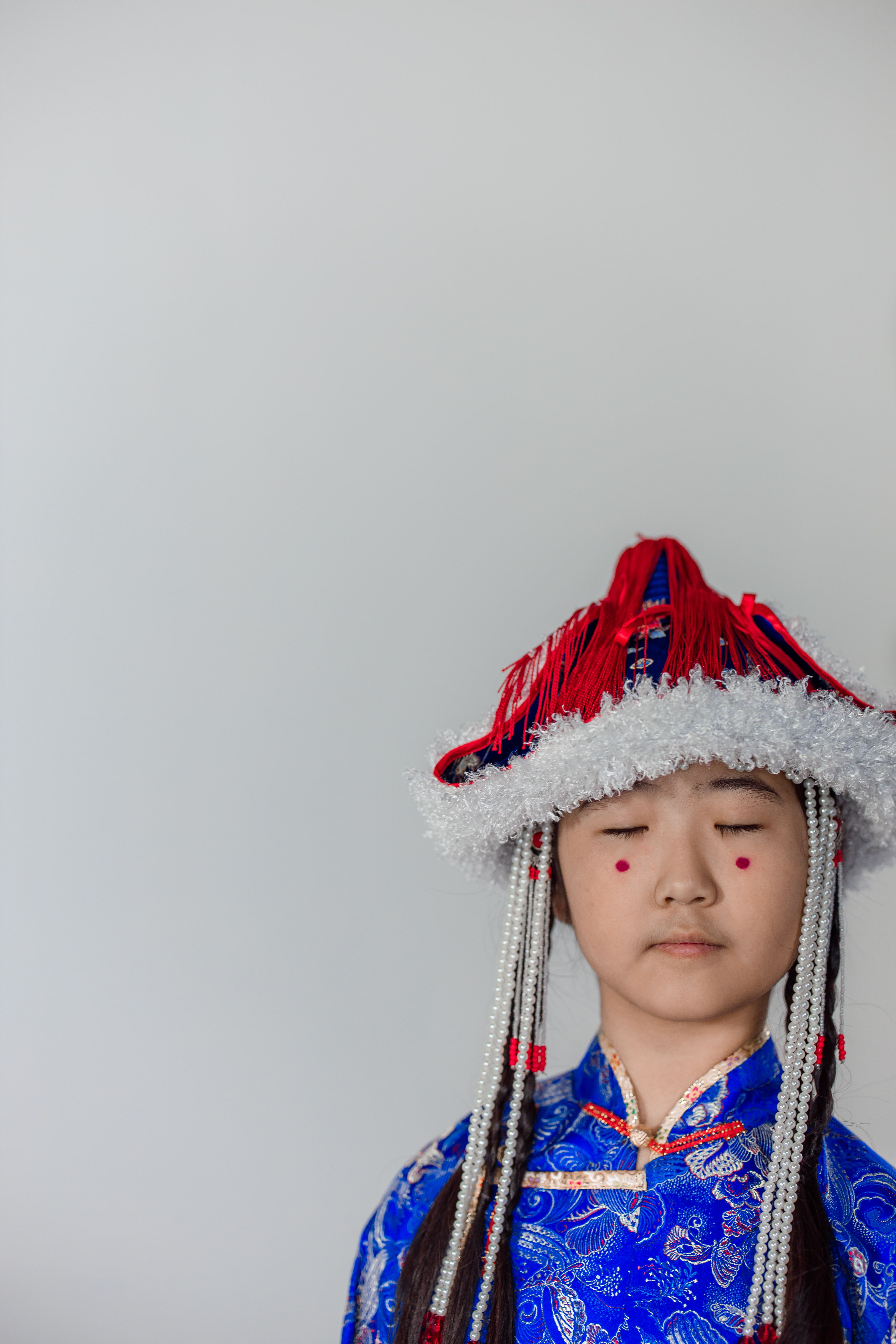 A Girl Wearing a Hat with Pearls Flipping Her Braided Hair · Free Stock ...
