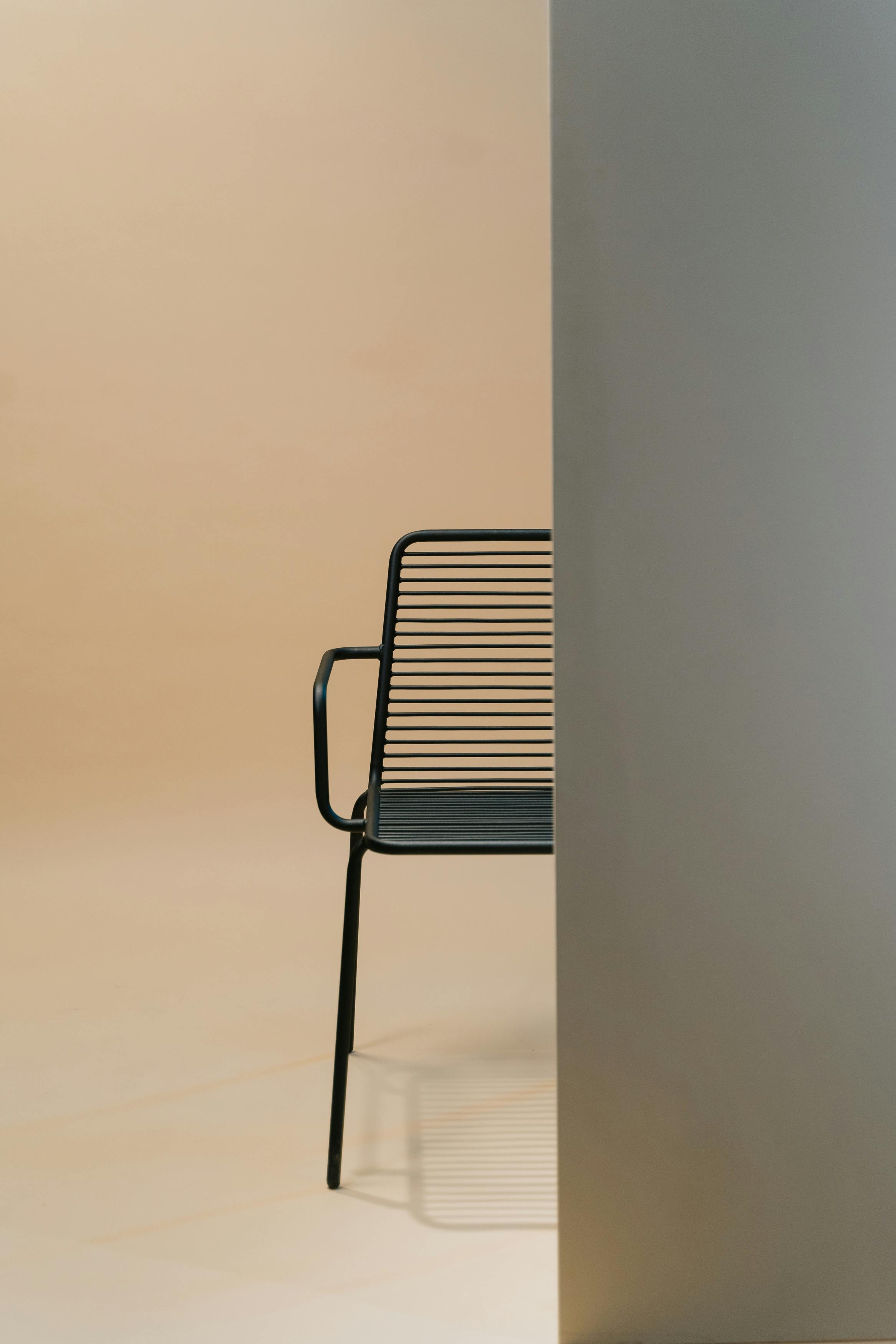 A Chair in the White Room Wall · Free Stock Photo