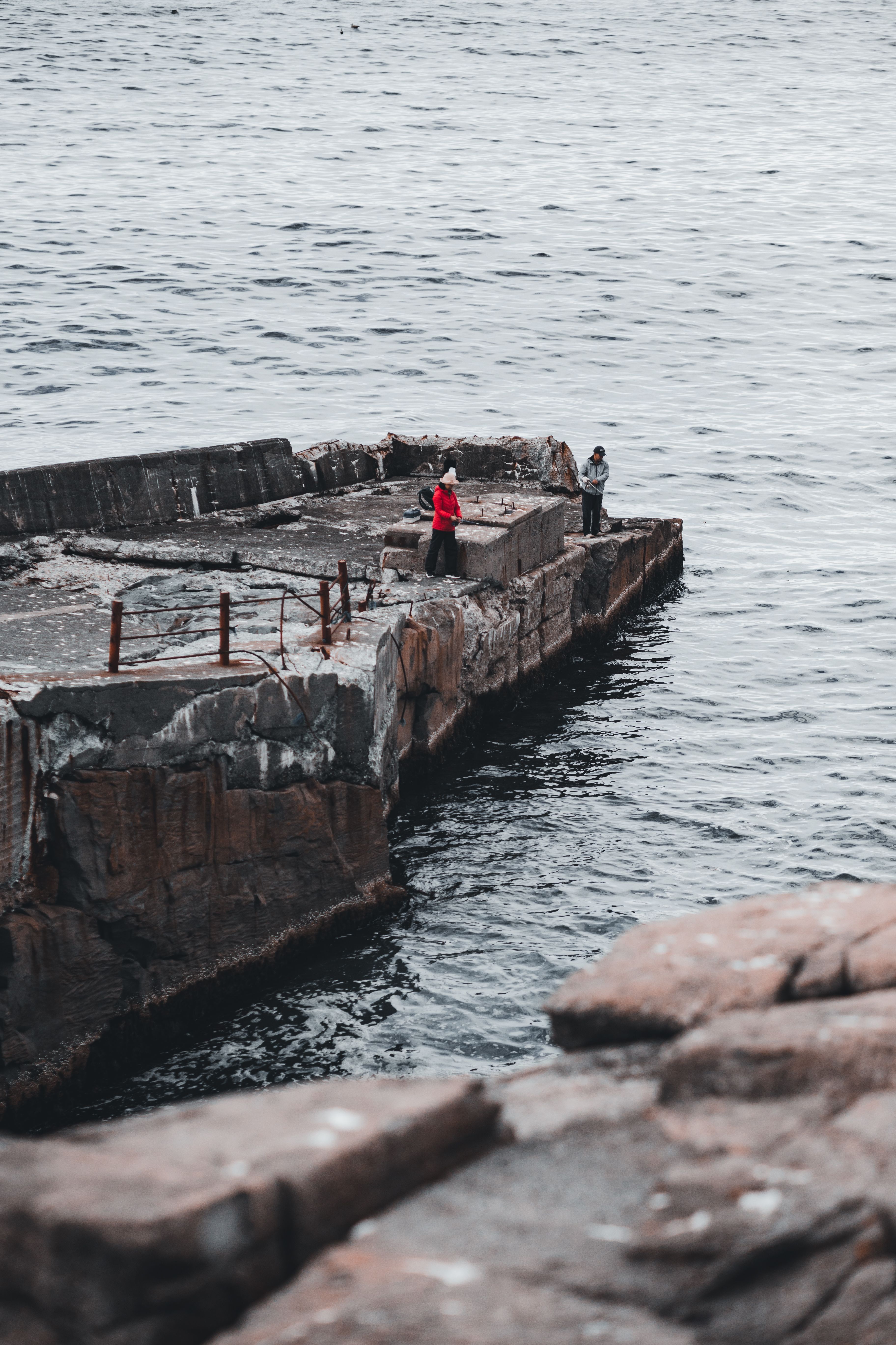 People Standing on Brown Concrete Dock while Fishing on the Sea · Free ...
