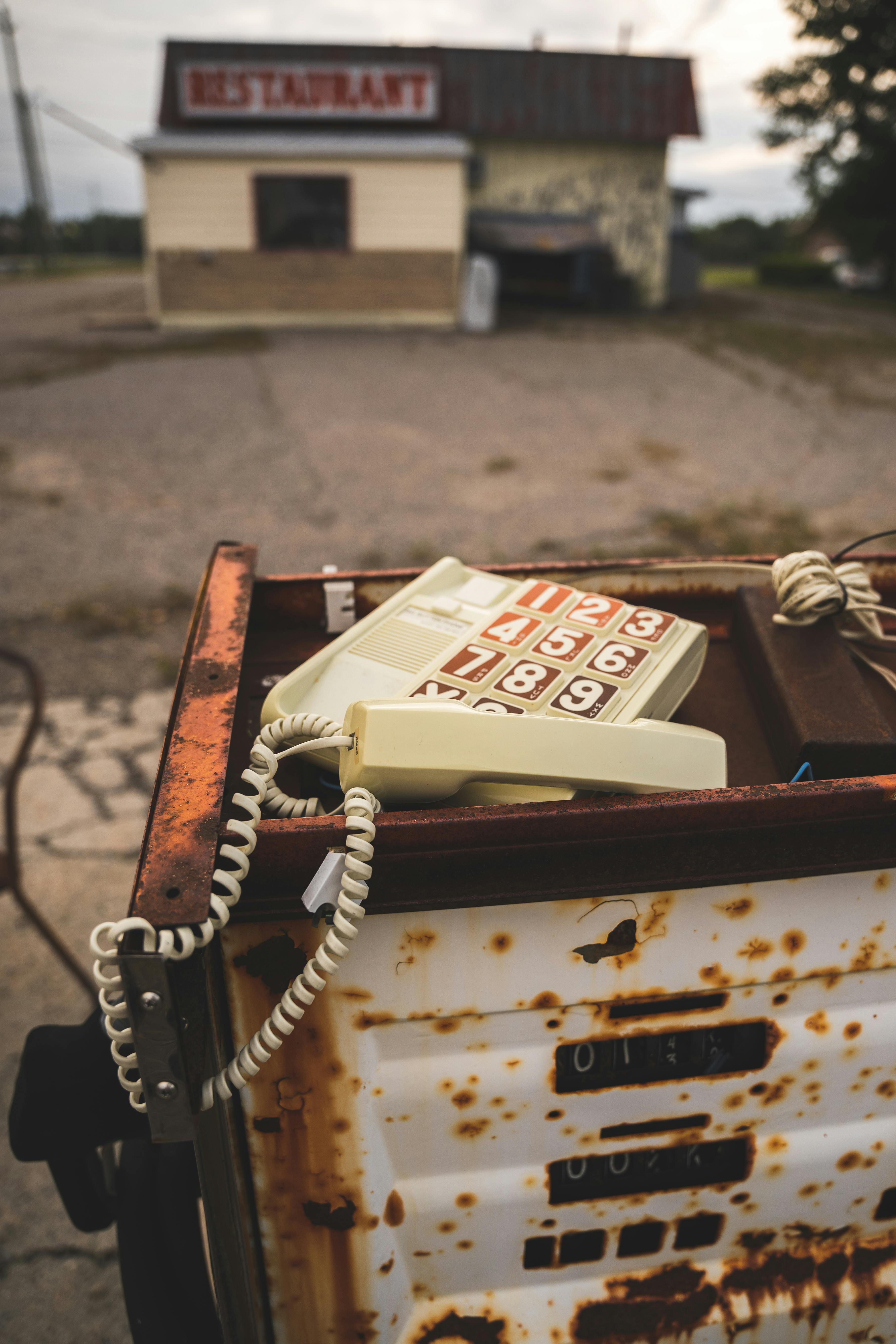 Telephone on Rusty Table · Free Stock Photo