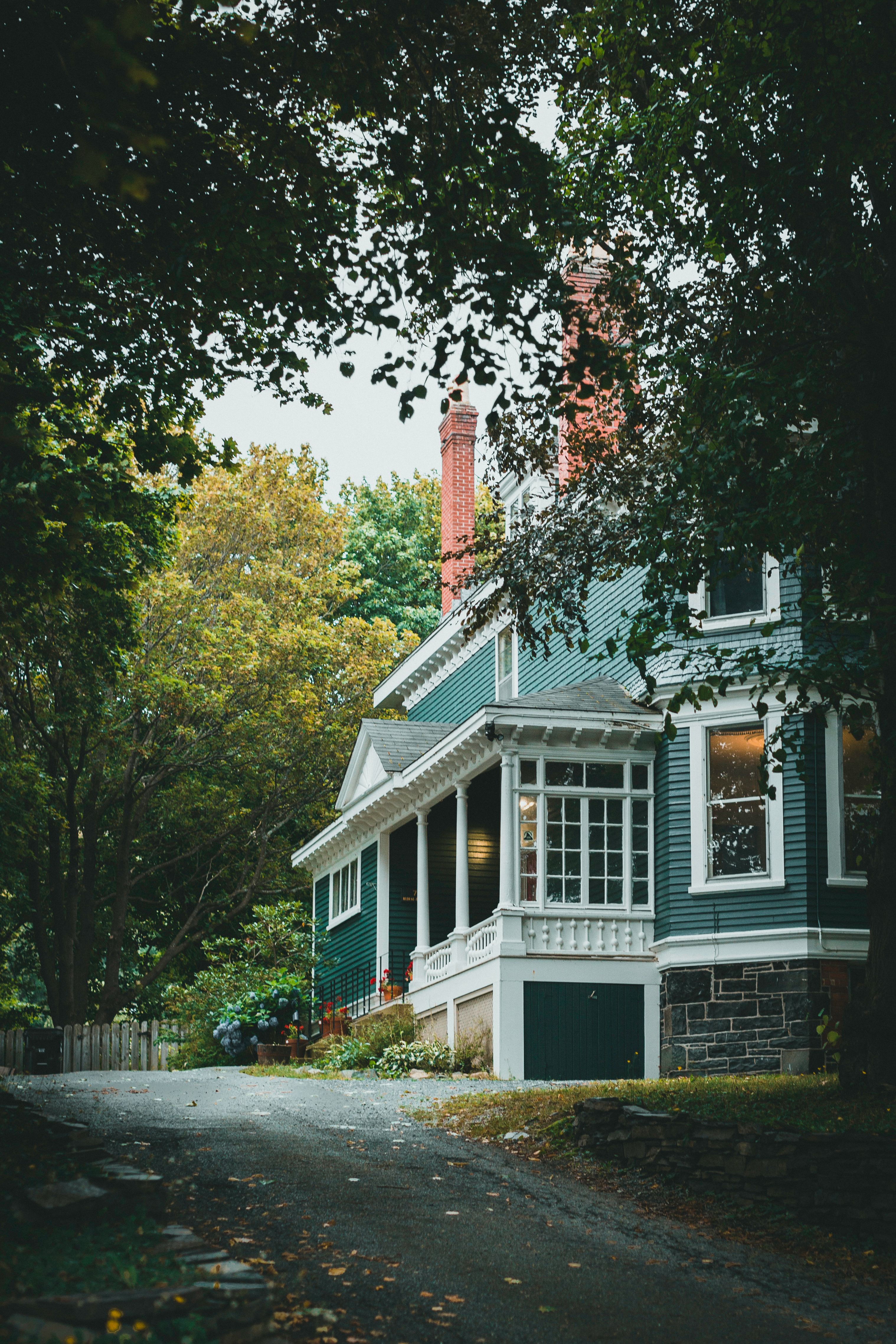 A Green House Surrounded with green Trees · Free Stock Photo