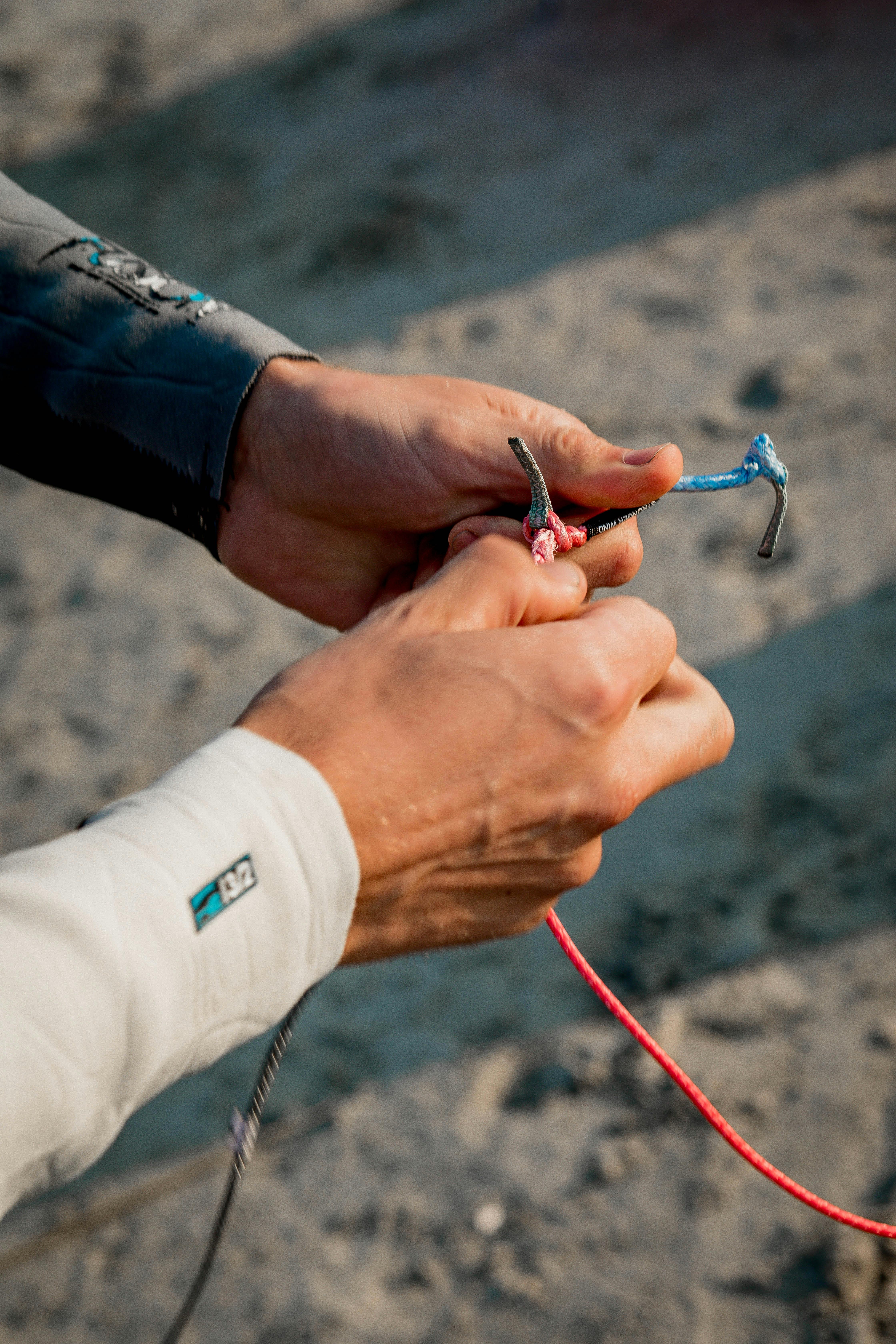 Hand on Wire Fence · Free Stock Photo