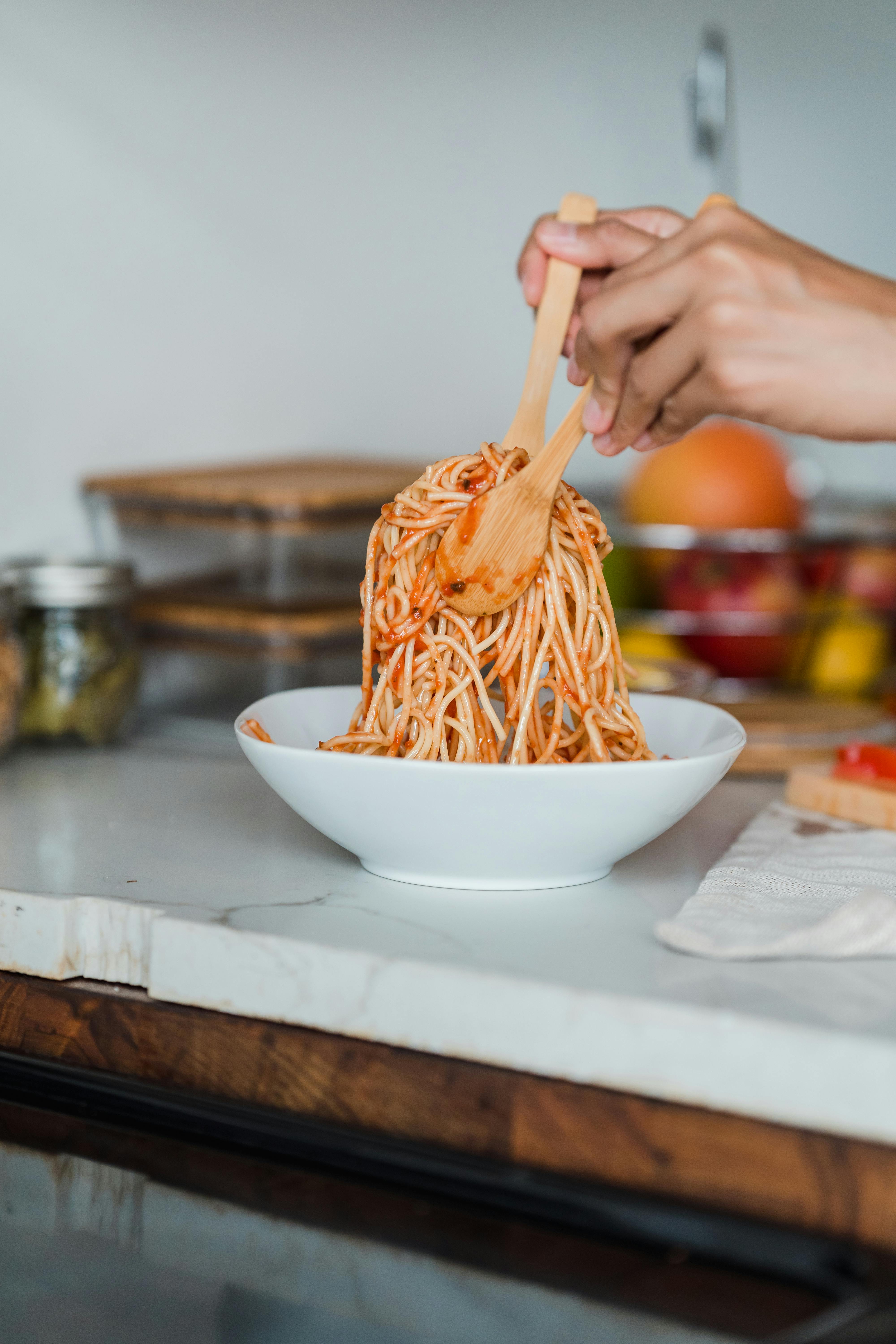 Person Mixing a Delicious Spaghetti · Free Stock Photo