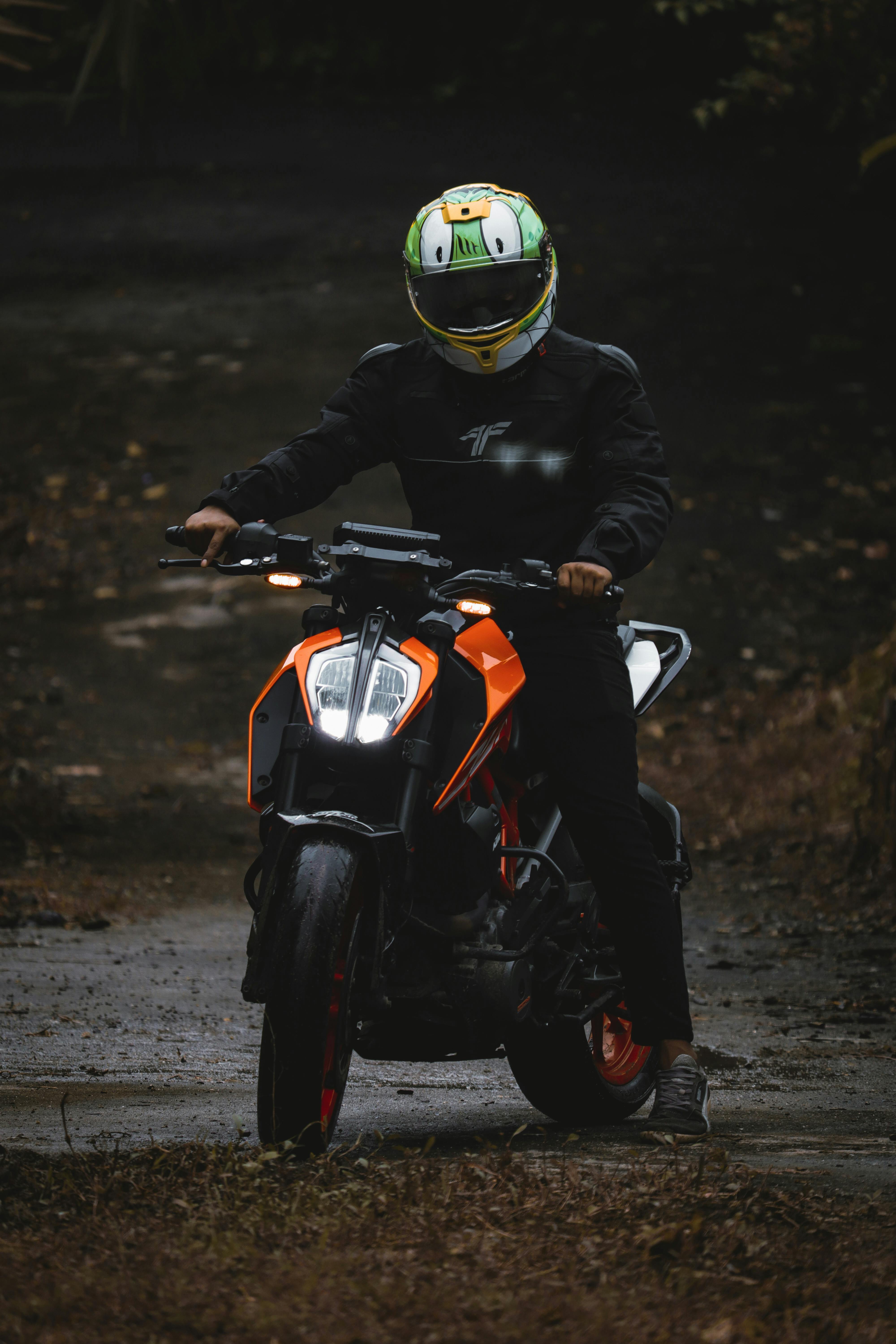 Photo of Man Riding a Red Motorcycle · Free Stock Photo