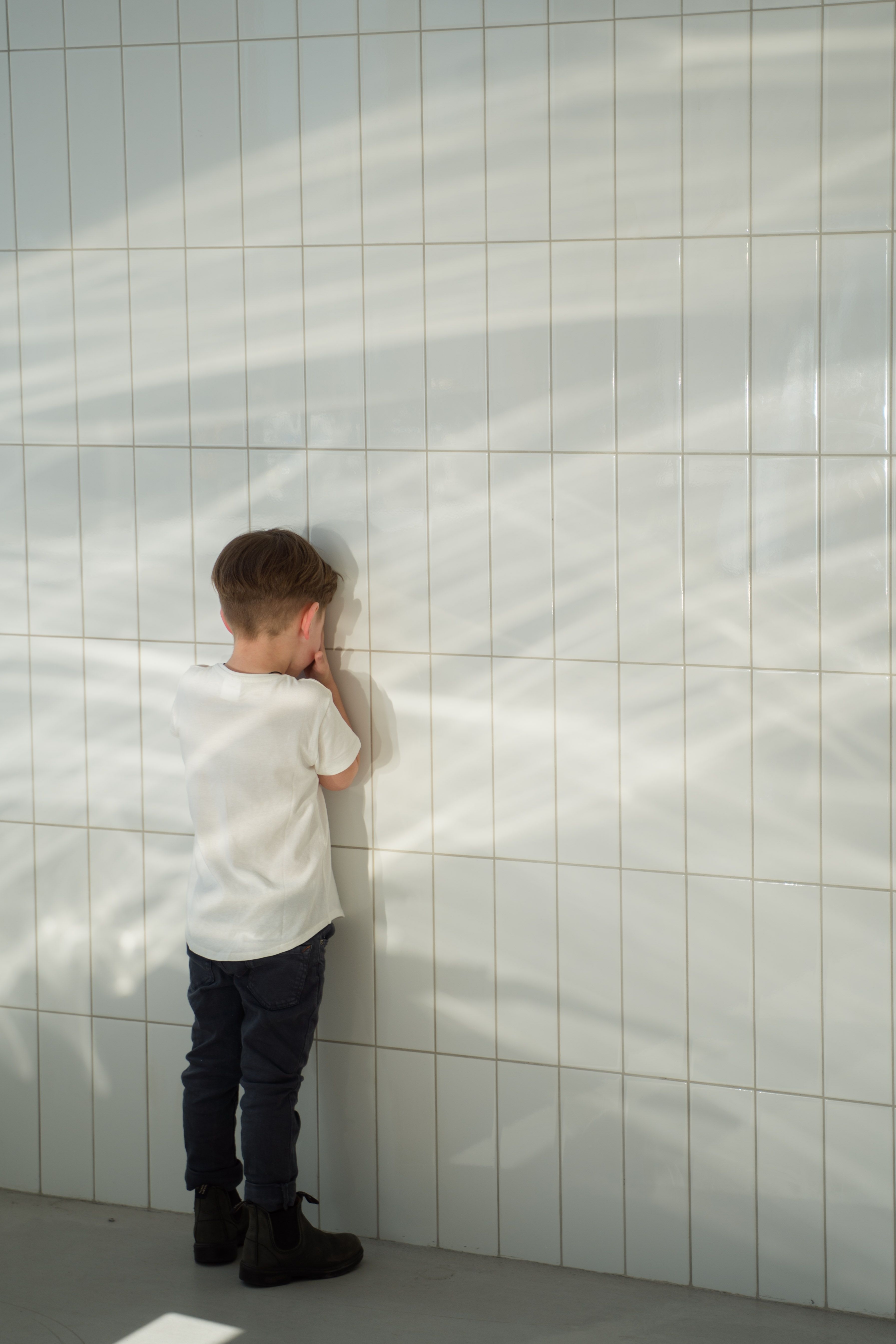 Boy Facing the Wall · Free Stock Photo