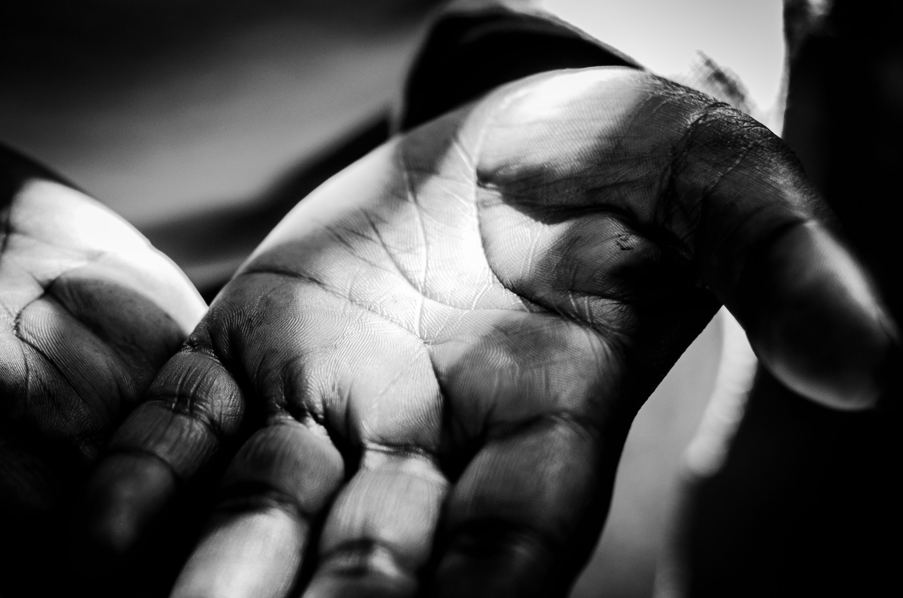Grayscale Photo of Man Grabbing Using Right Hand · Free Stock Photo