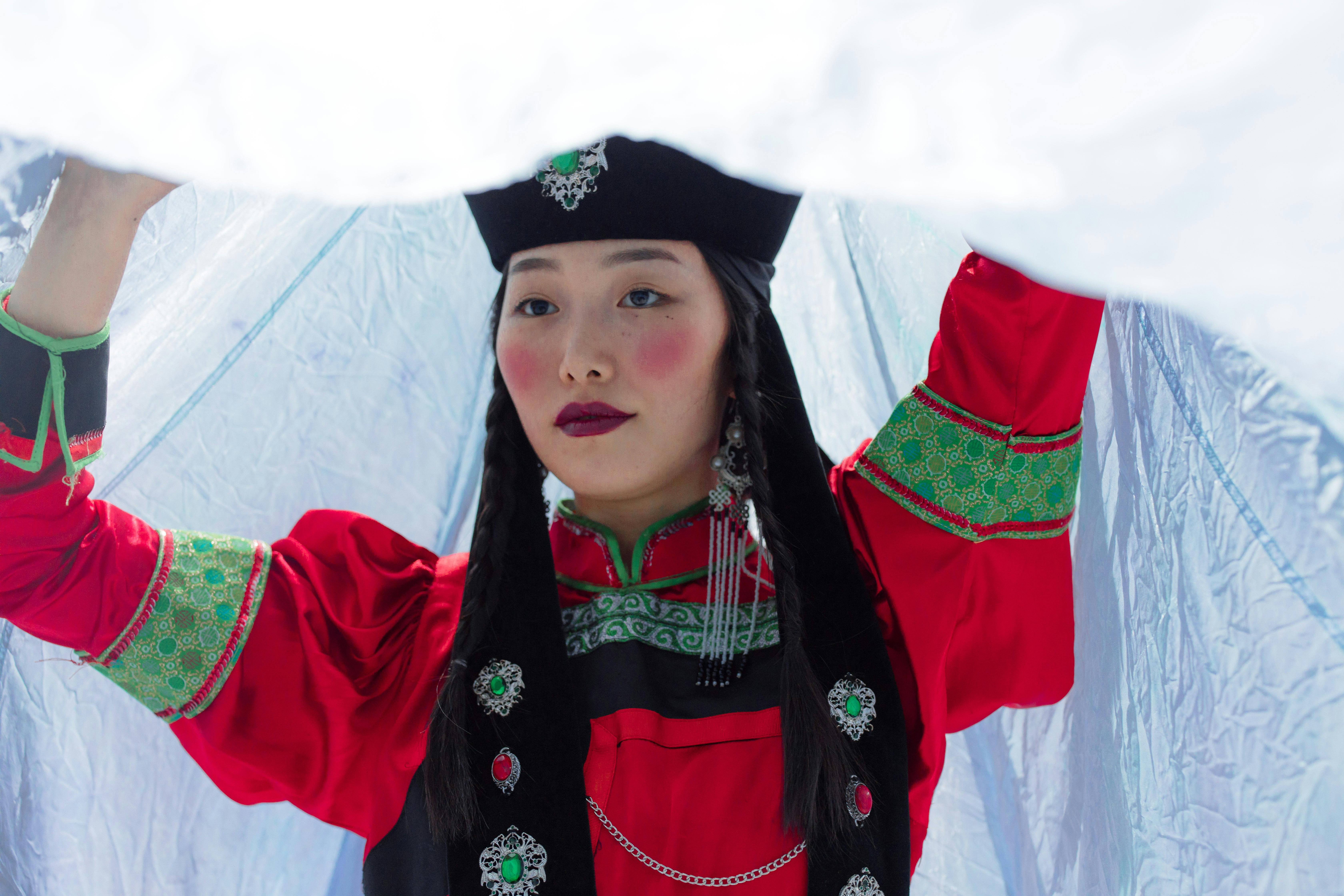 Brunette Buryat Woman in Red Dress Posing Under Shining Fabric · Free ...