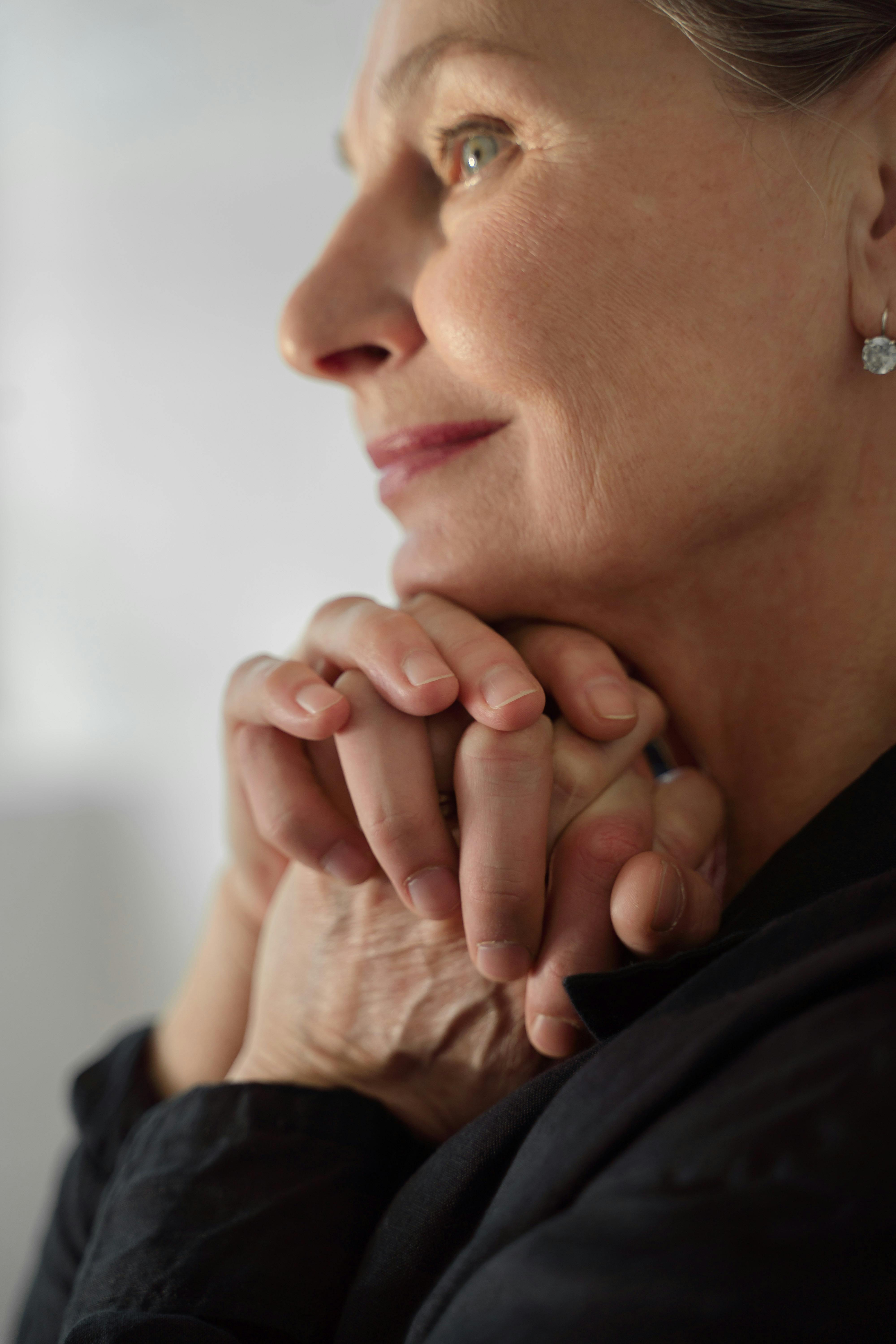 Woman with Hands Clasped · Free Stock Photo