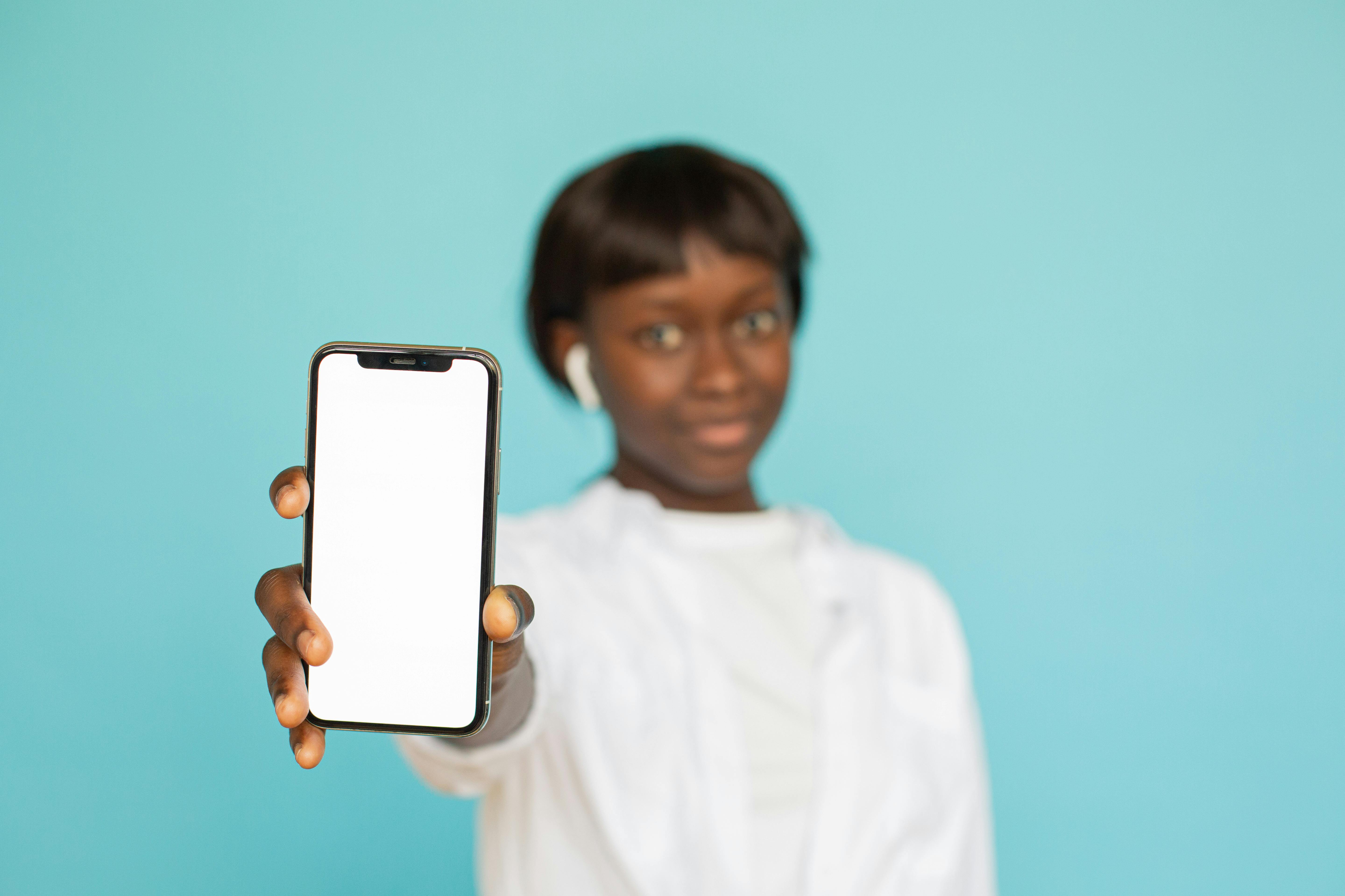 Person Holding Black Iphone · Free Stock Photo