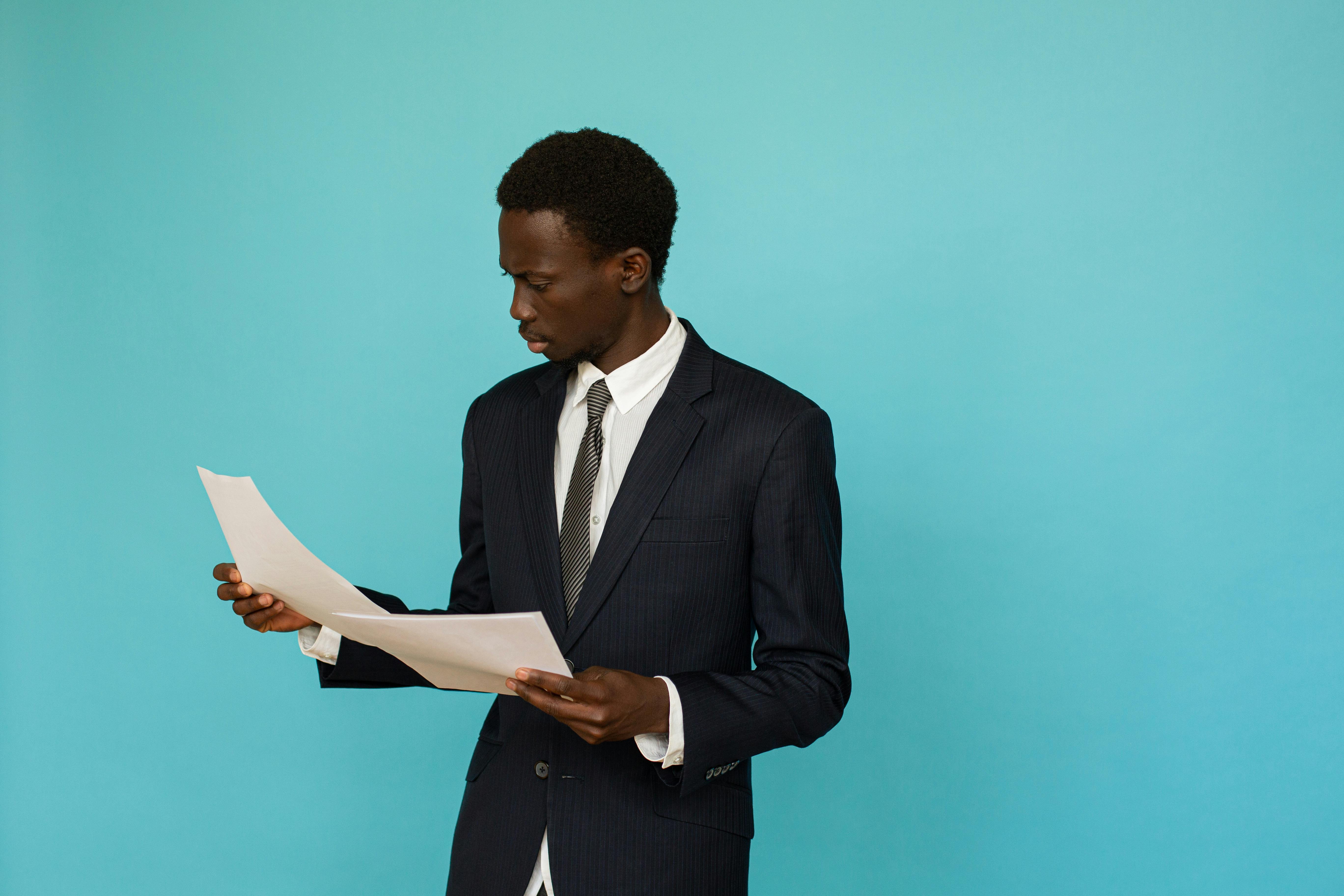 Professional Man looking at Papers · Free Stock Photo