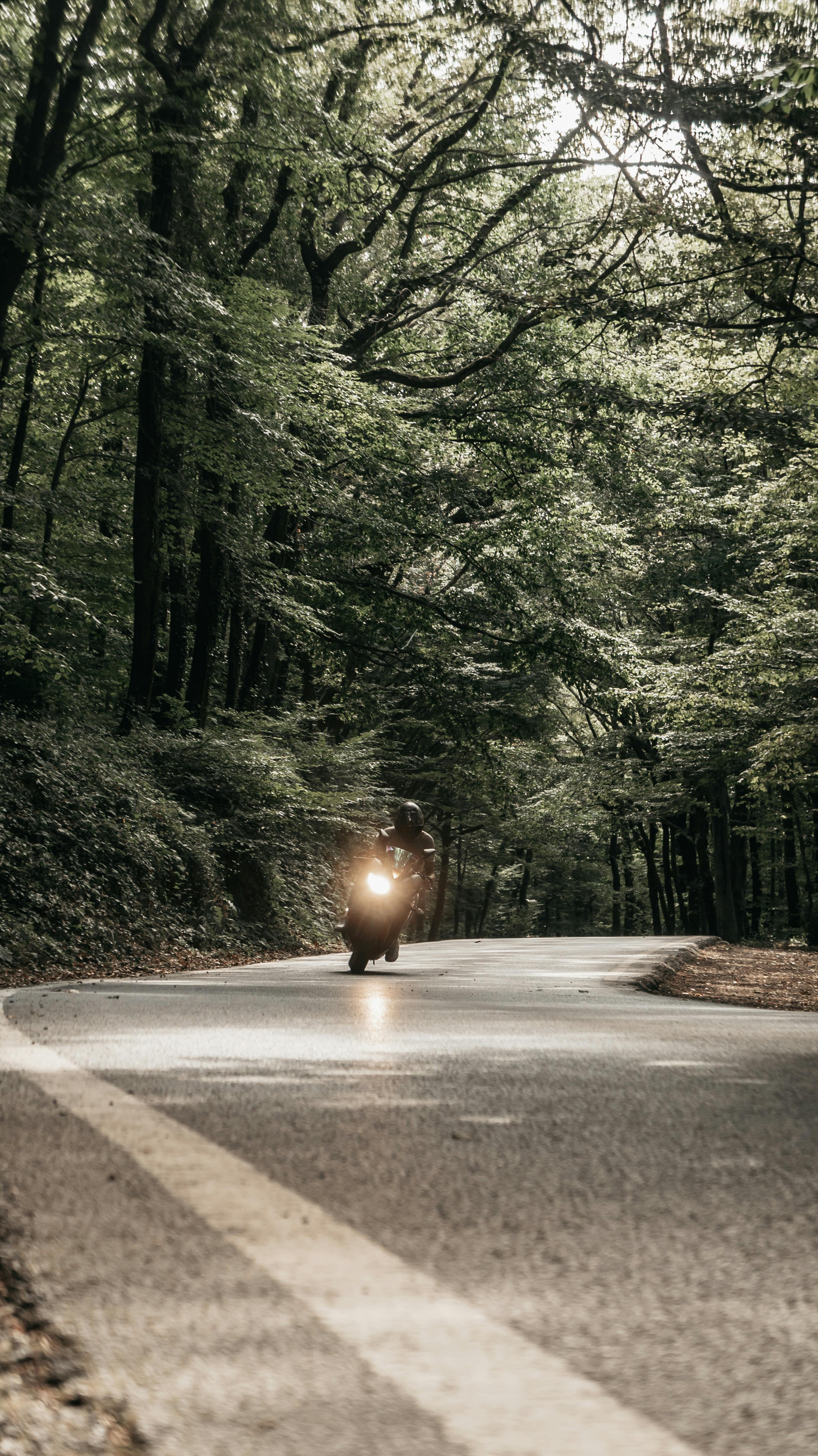Person Riding a Motorcycle during Night Time · Free Stock Photo