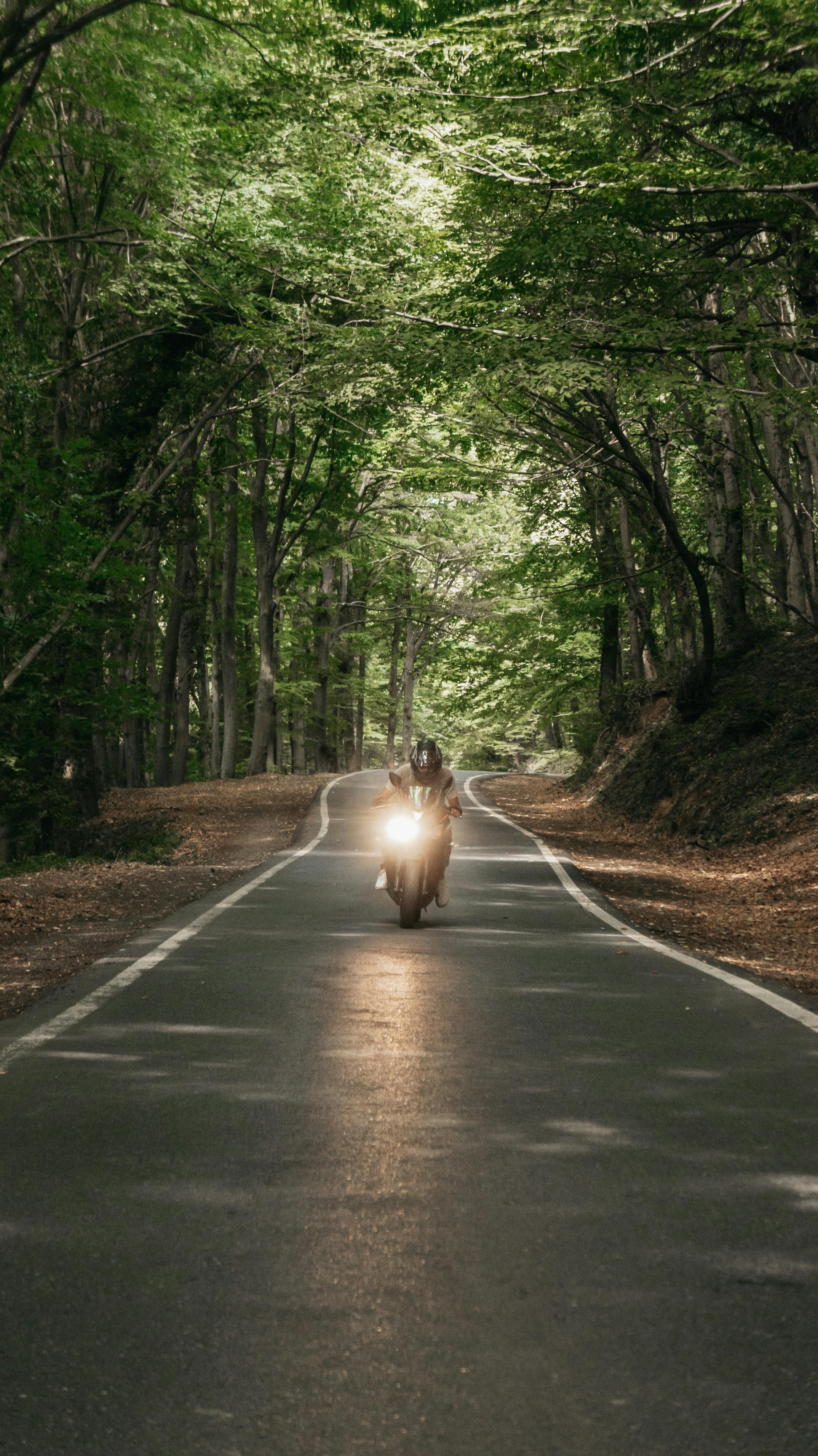 2 People Riding Motorcycle on Road · Free Stock Photo