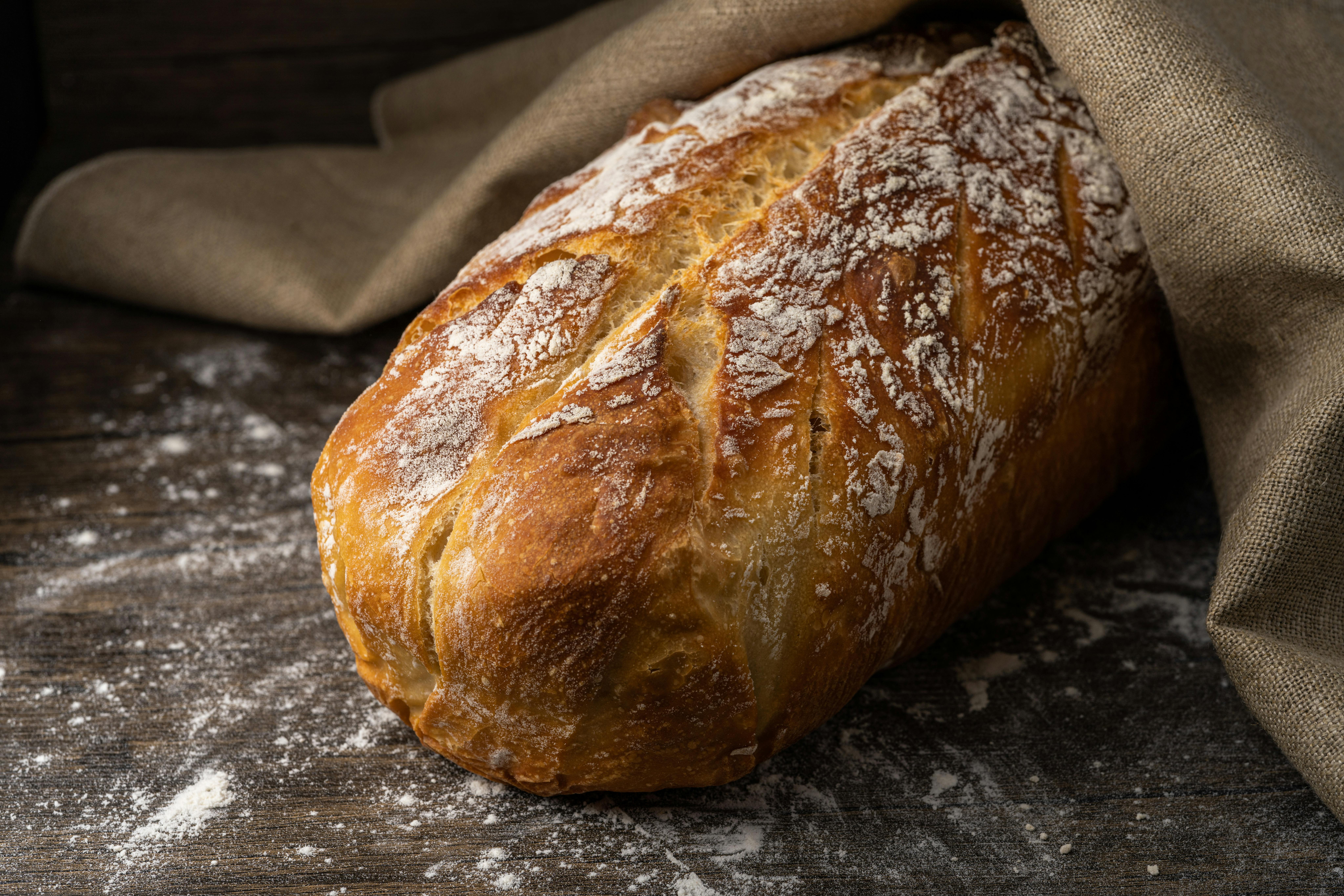 Photo Of Breads On Top Of Wooden Table · Free Stock Photo