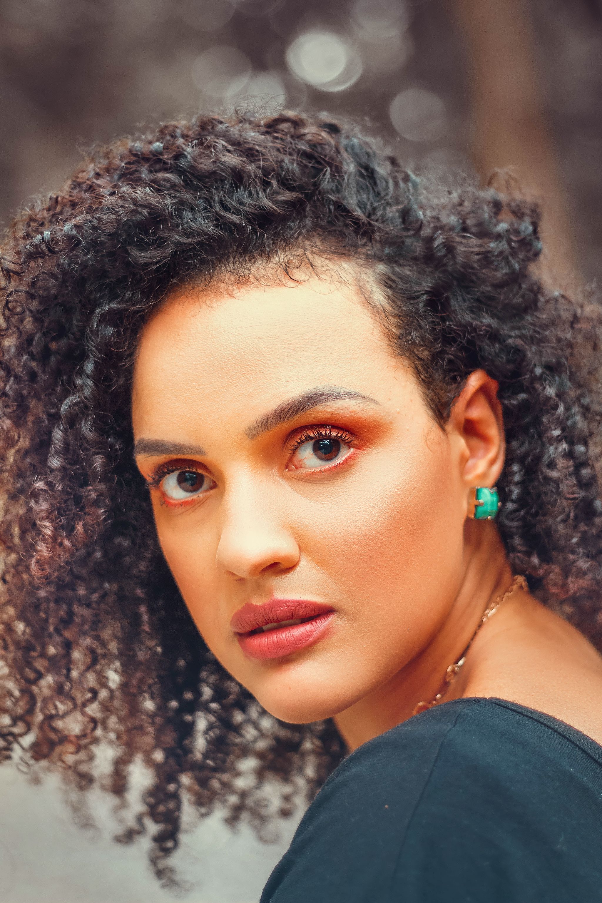 Close-Up Photo of a Woman with Curly Hair · Free Stock Photo