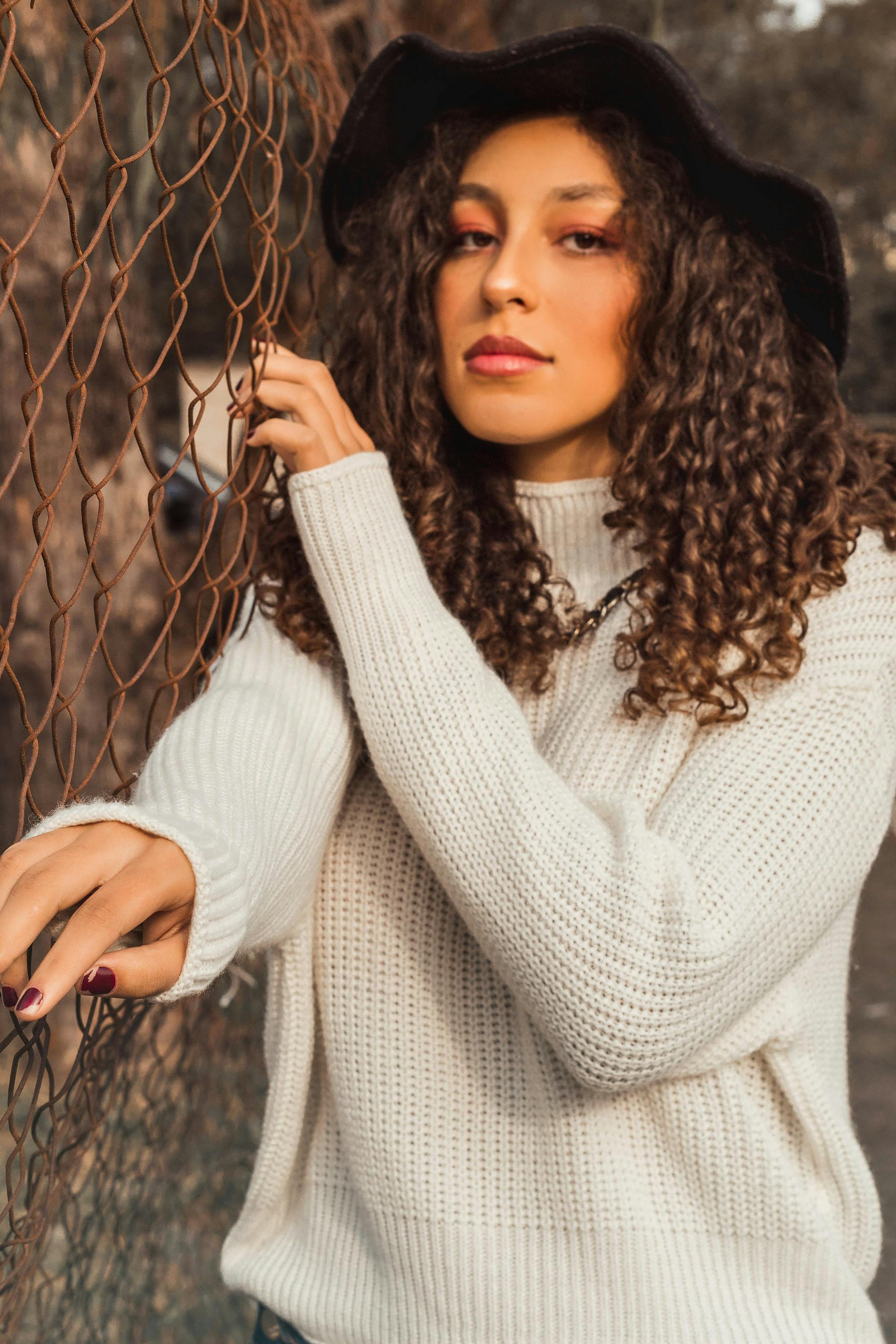 Woman Standing Behind Chain Link Fence · Free Stock Photo