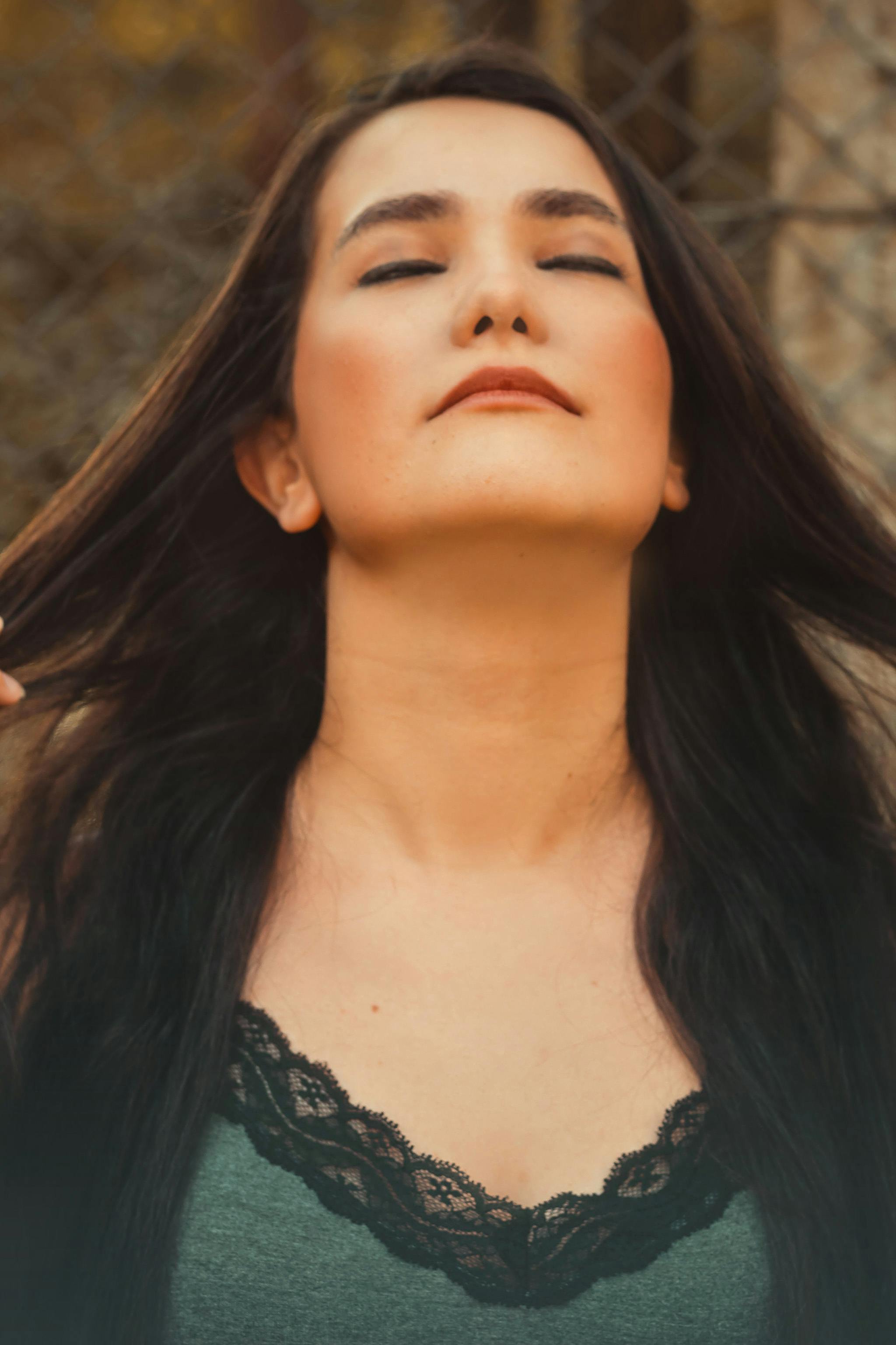 Woman Posing with Her Head Up · Free Stock Photo