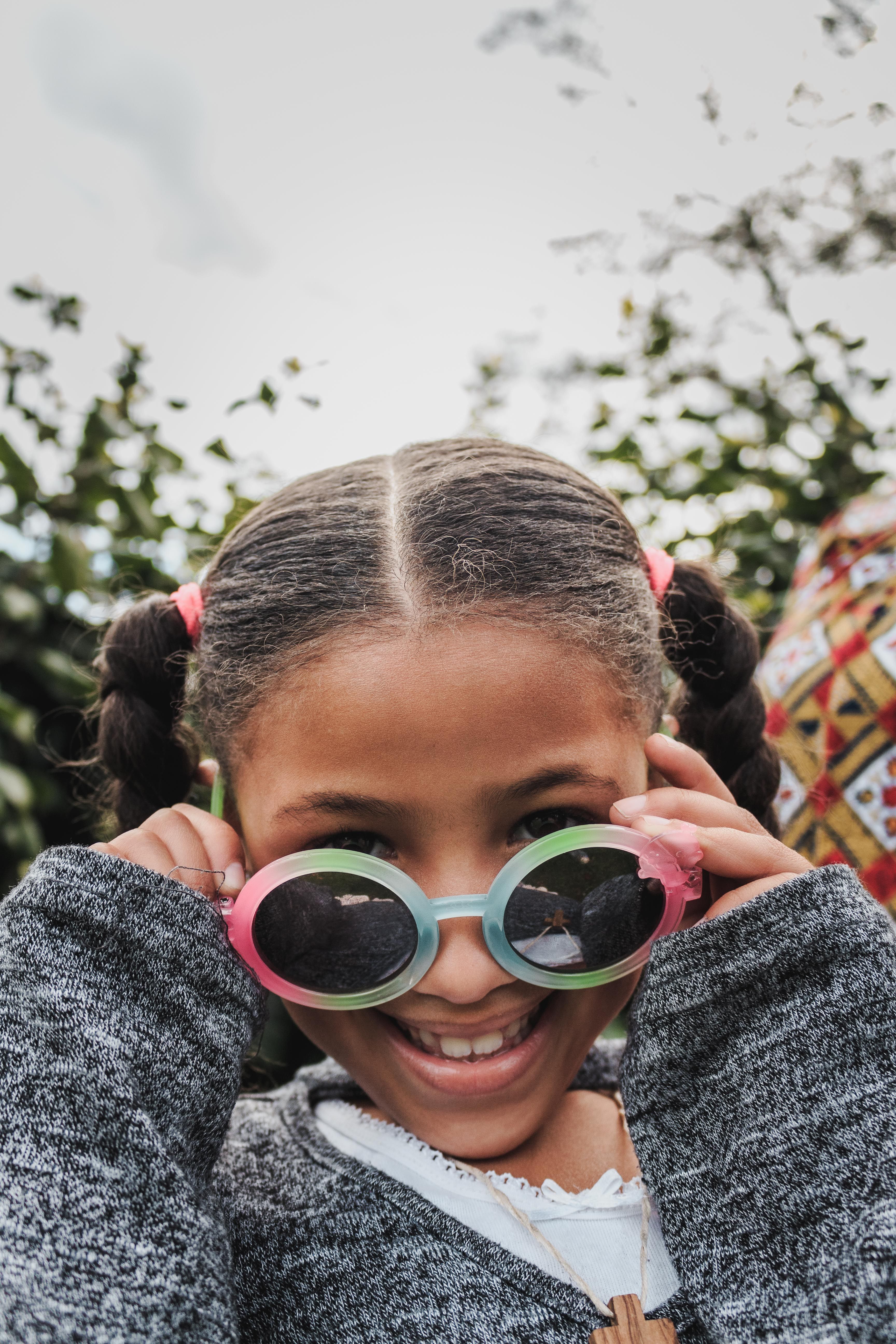 Girl in White Shirt with Green Paint on her Cheeks · Free Stock Photo