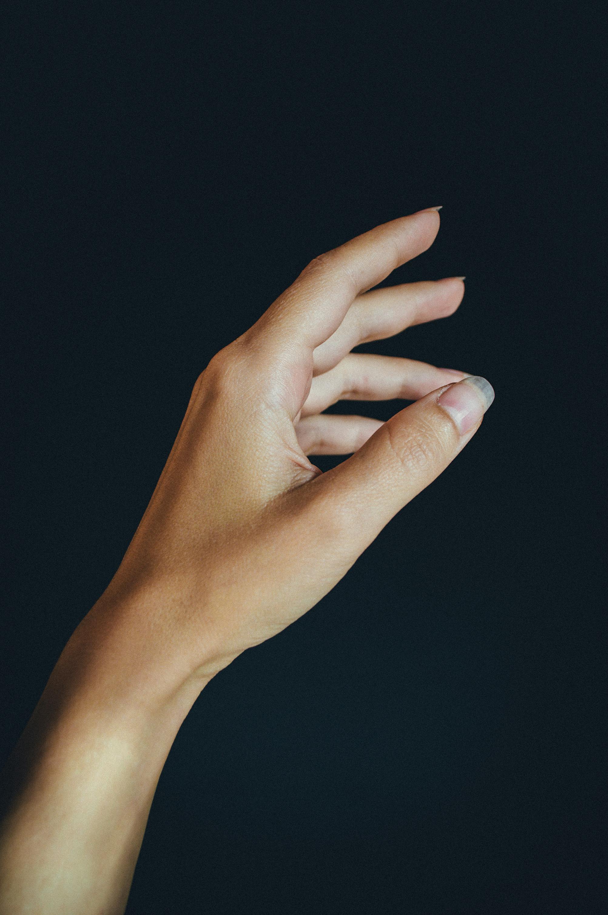 Close-Up Shot of a Hand on Black Background · Free Stock Photo
