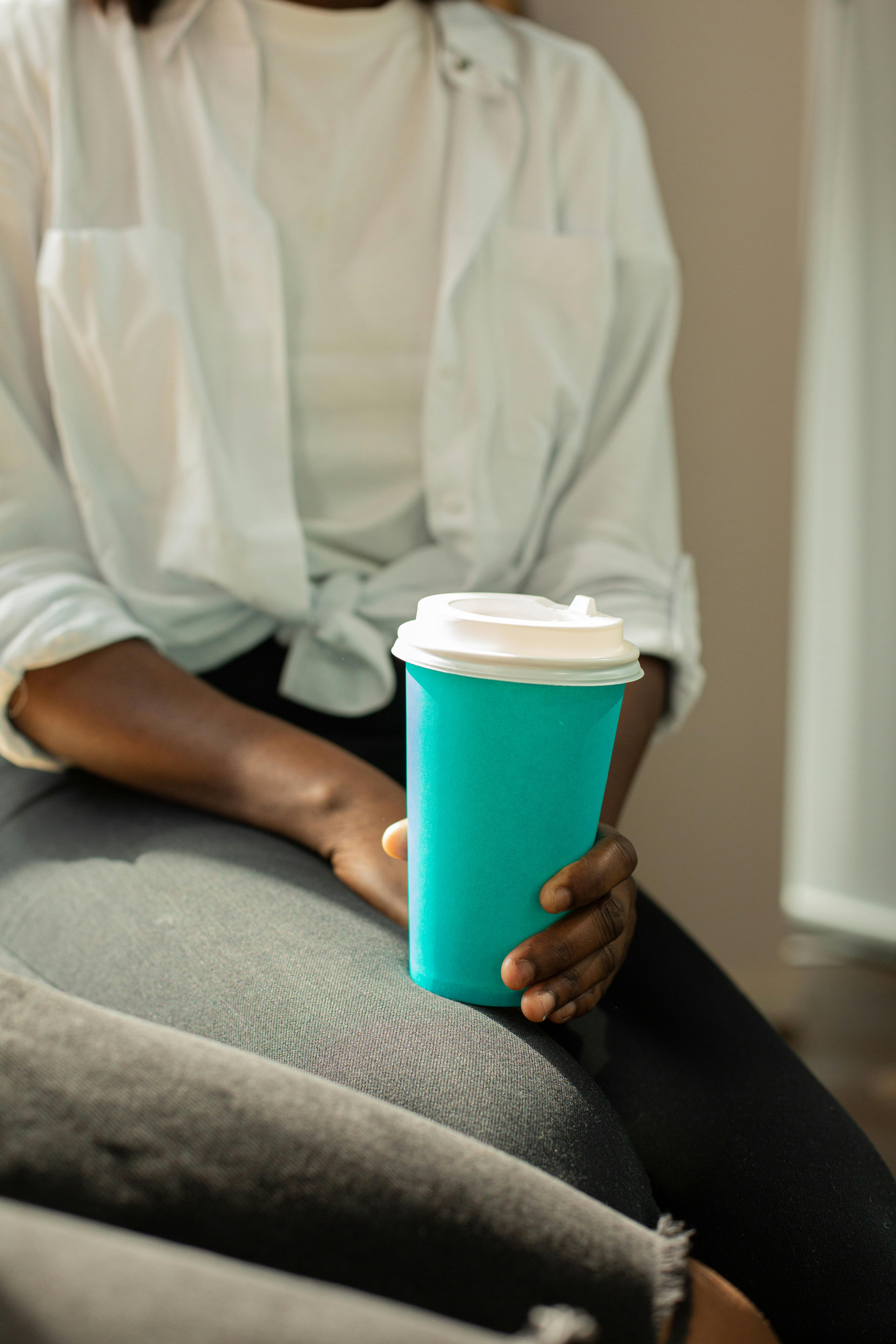 Person Holding a White Cup · Free Stock Photo