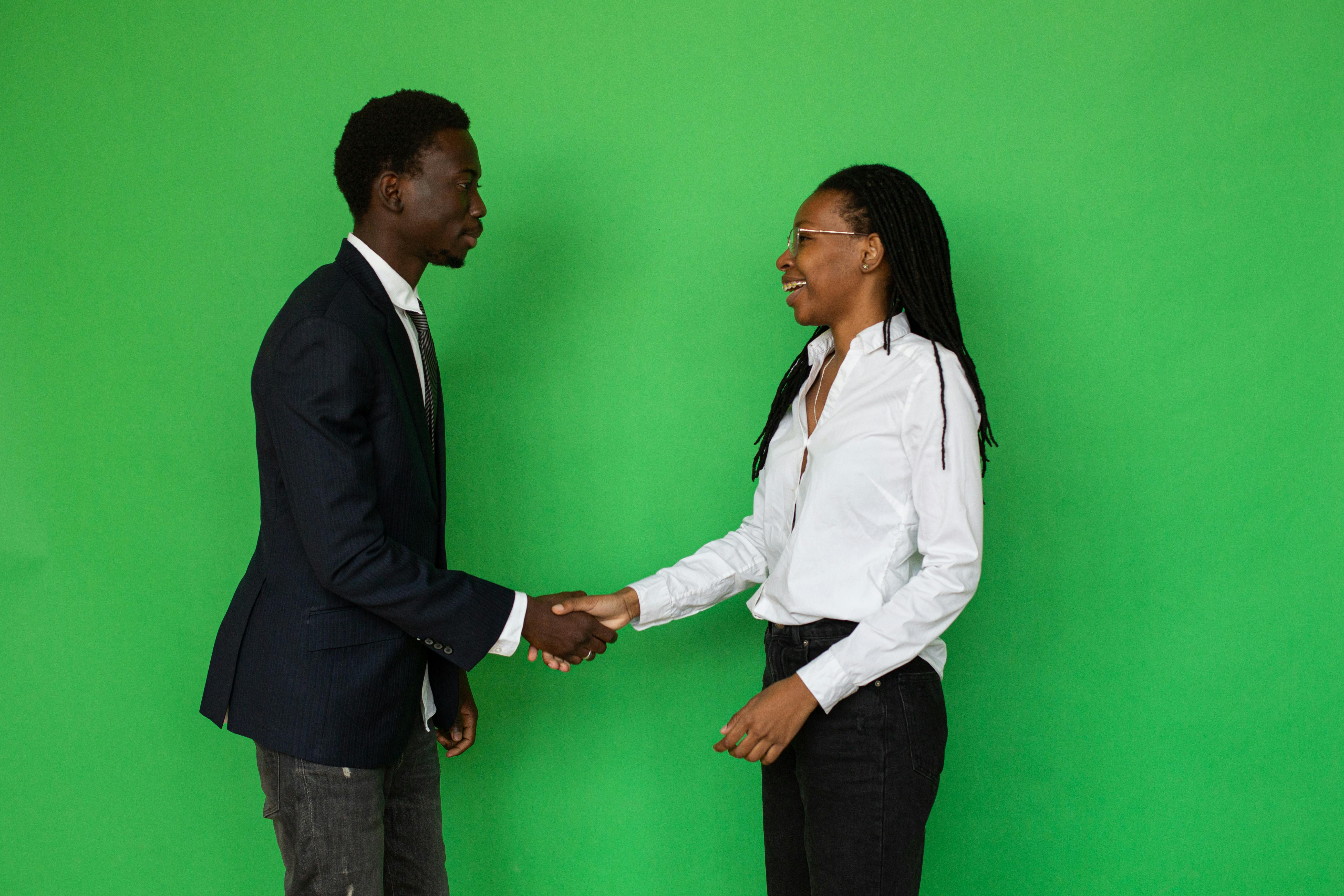 Crop unrecognizable multiethnic colleagues joining hands · Free Stock Photo