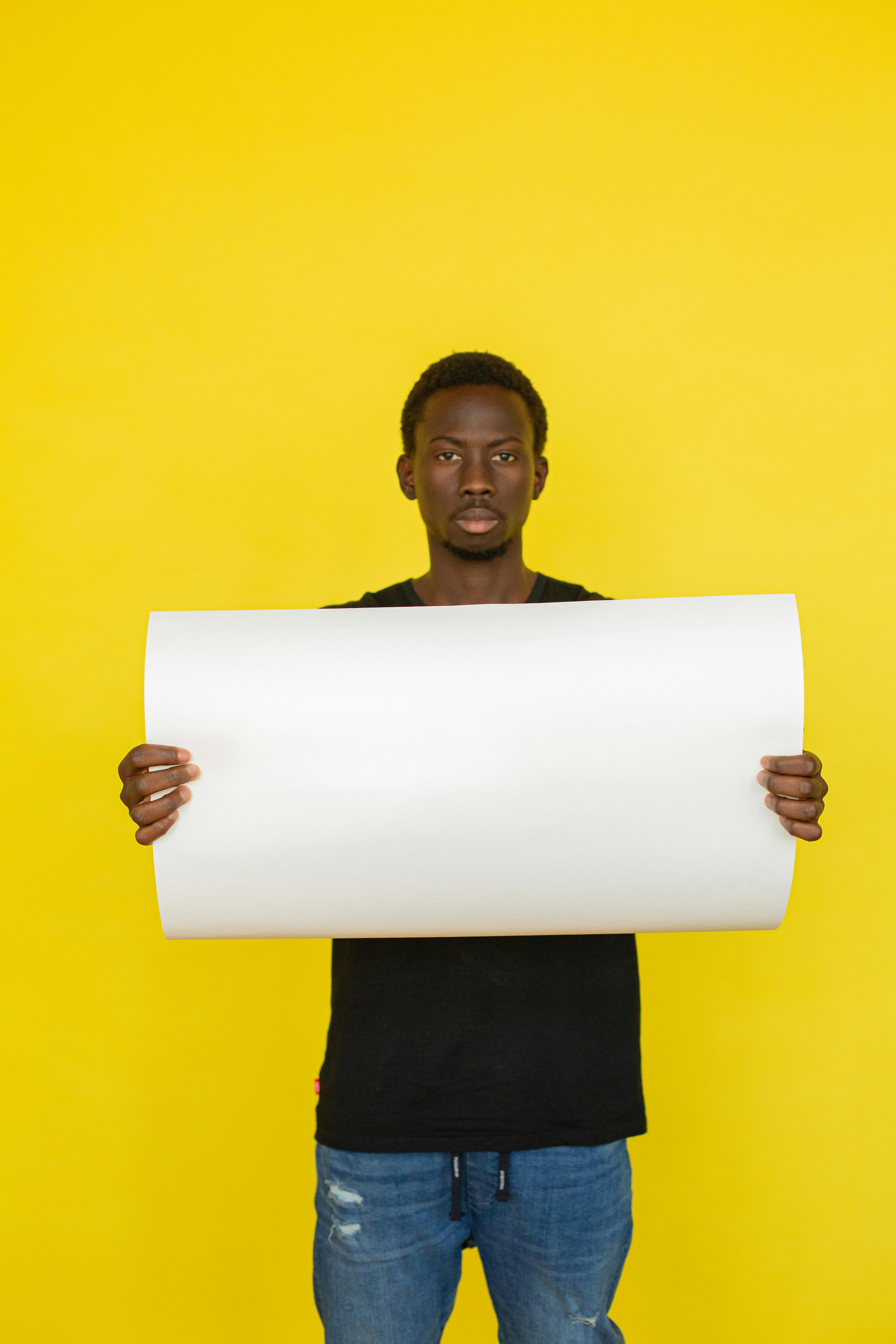 Person Holding Blank Paper
