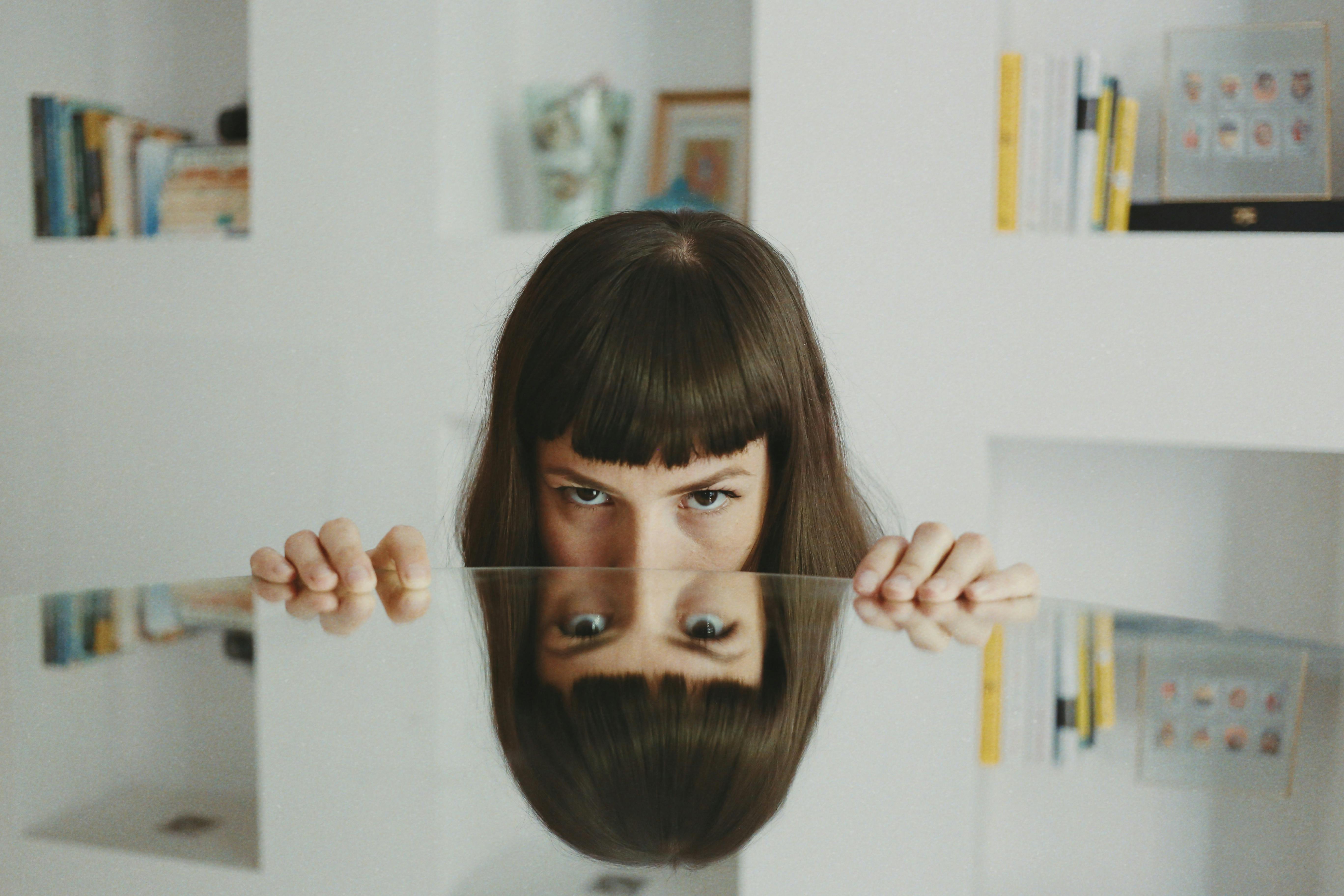 Reflection of Person on the Round Glass Table · Free Stock Photo