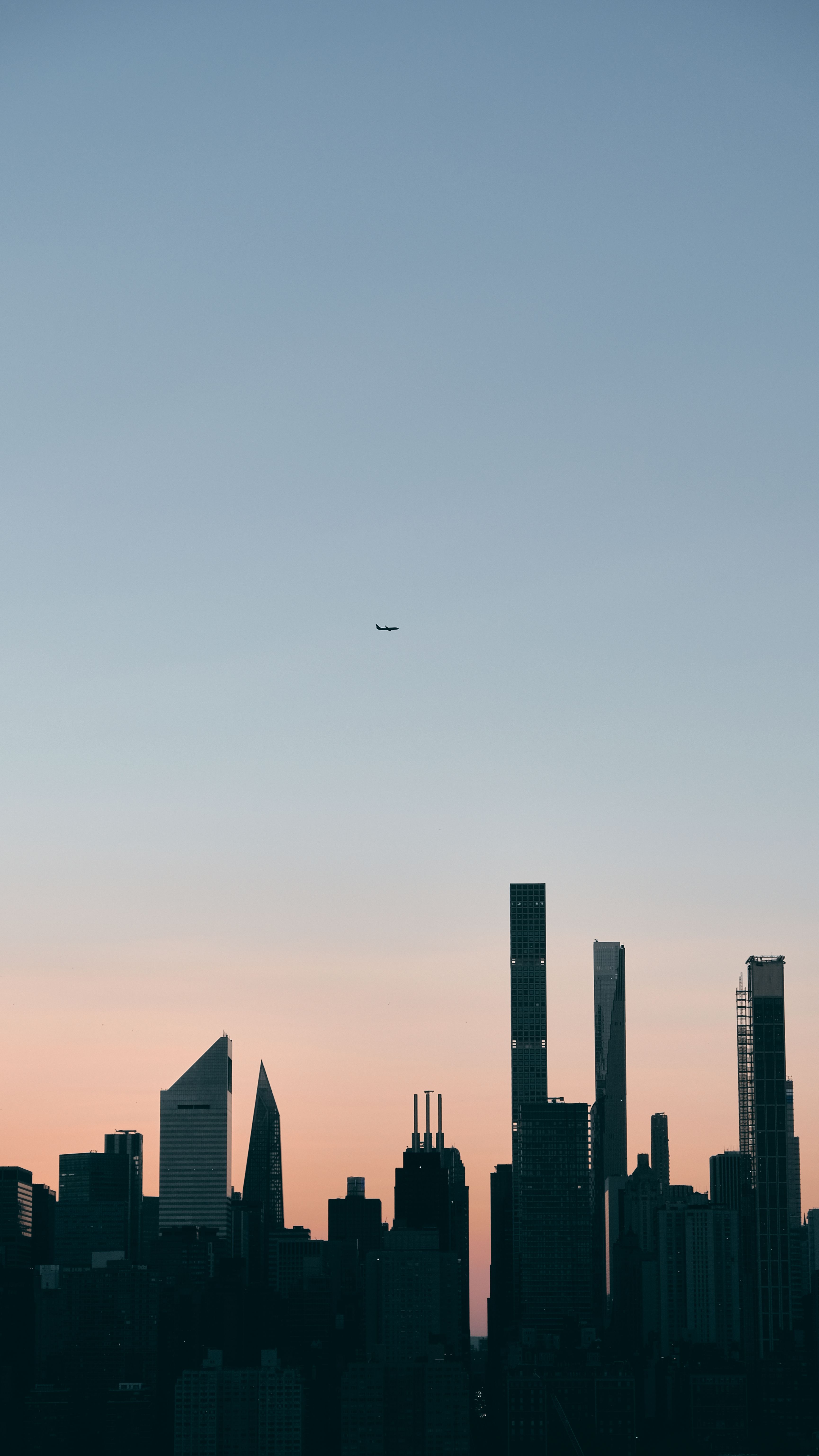 Sun over City Skyscrapers Silhouette behind Window at Sunset · Free ...