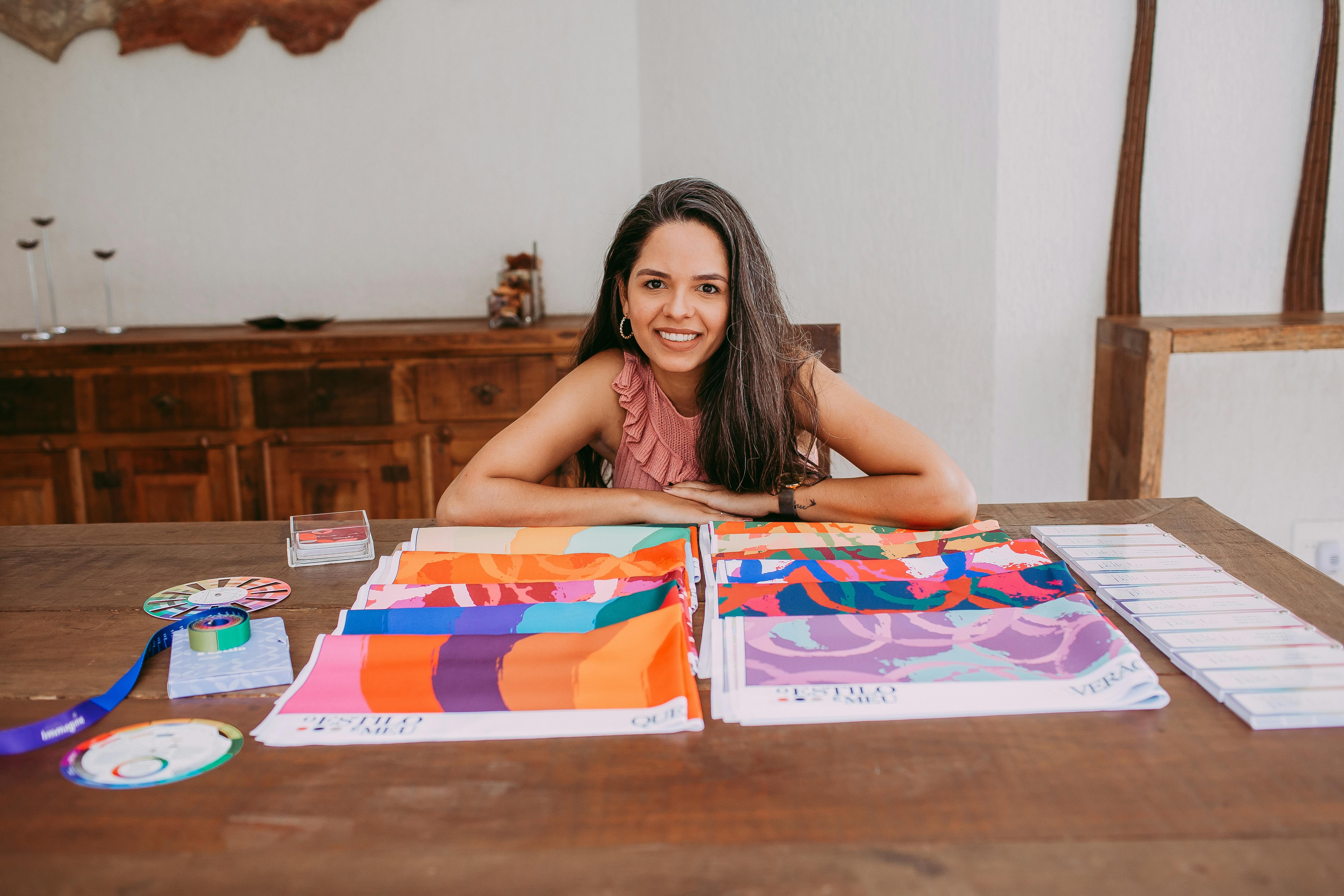 Portrait of a Smiling Woman with Samples · Free Stock Photo