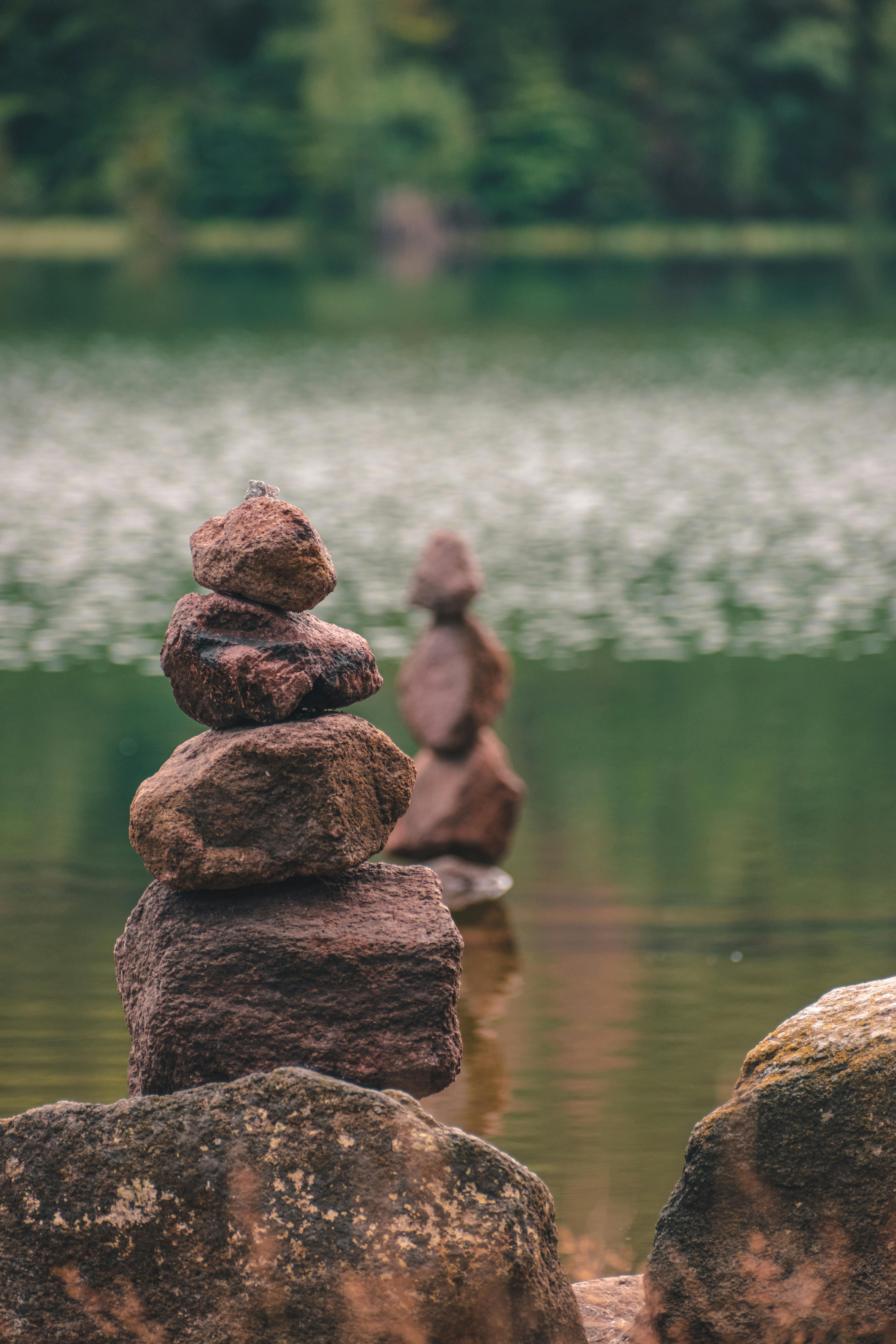 Close-up of a Stack of Stones Near Water · Free Stock Photo