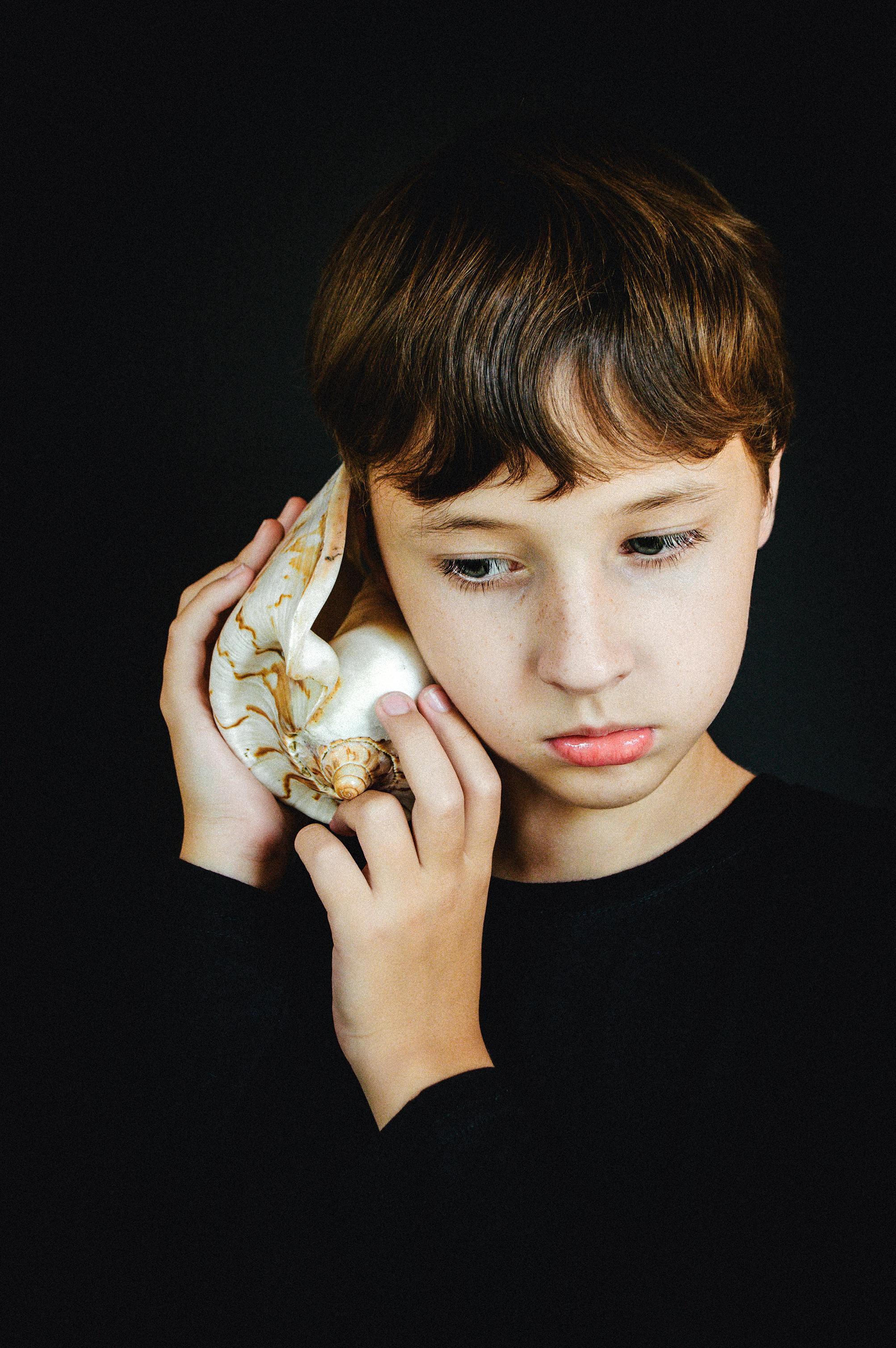 Boy Holding Shell · Free Stock Photo