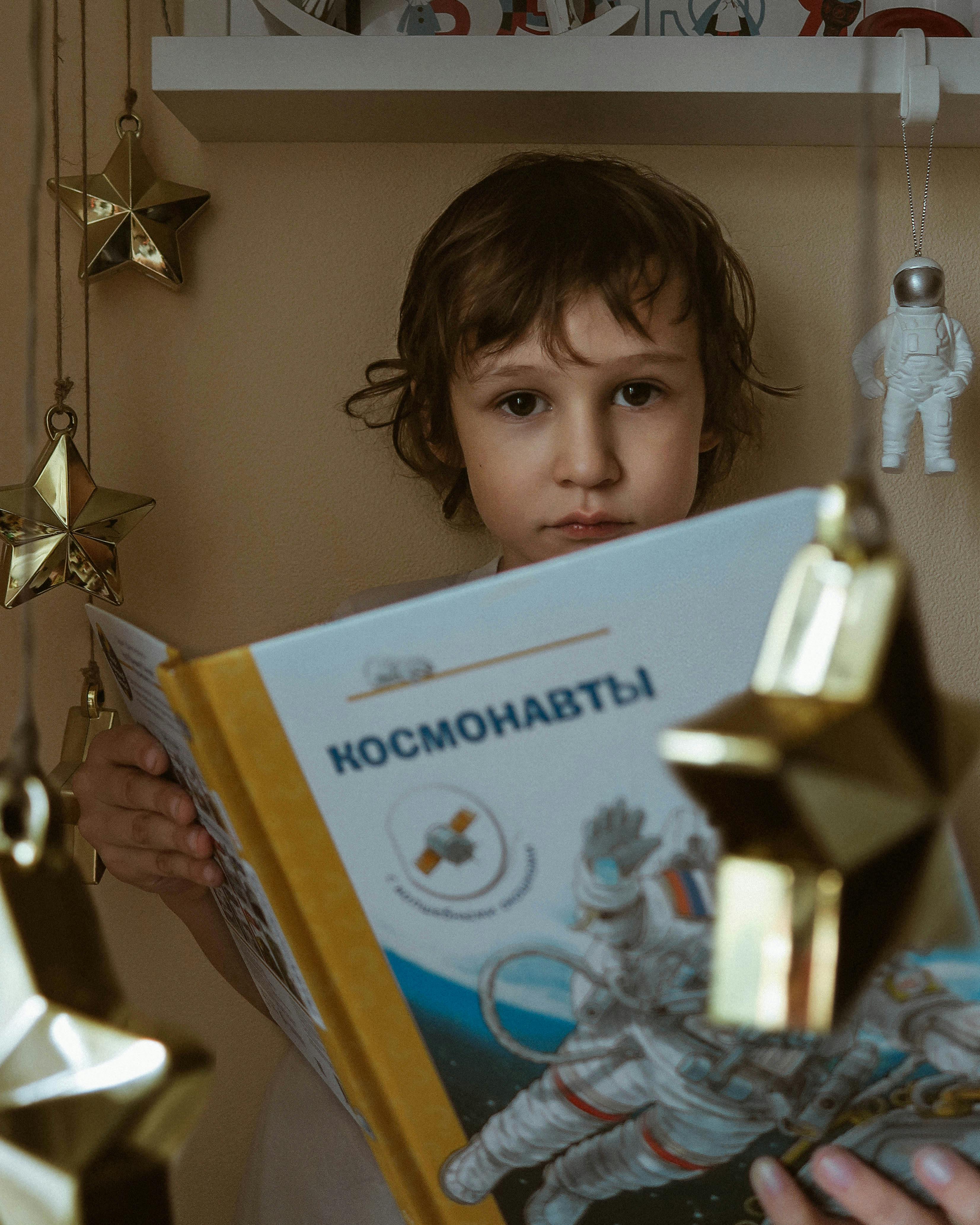 Little Child Sitting with an Open Book · Free Stock Photo