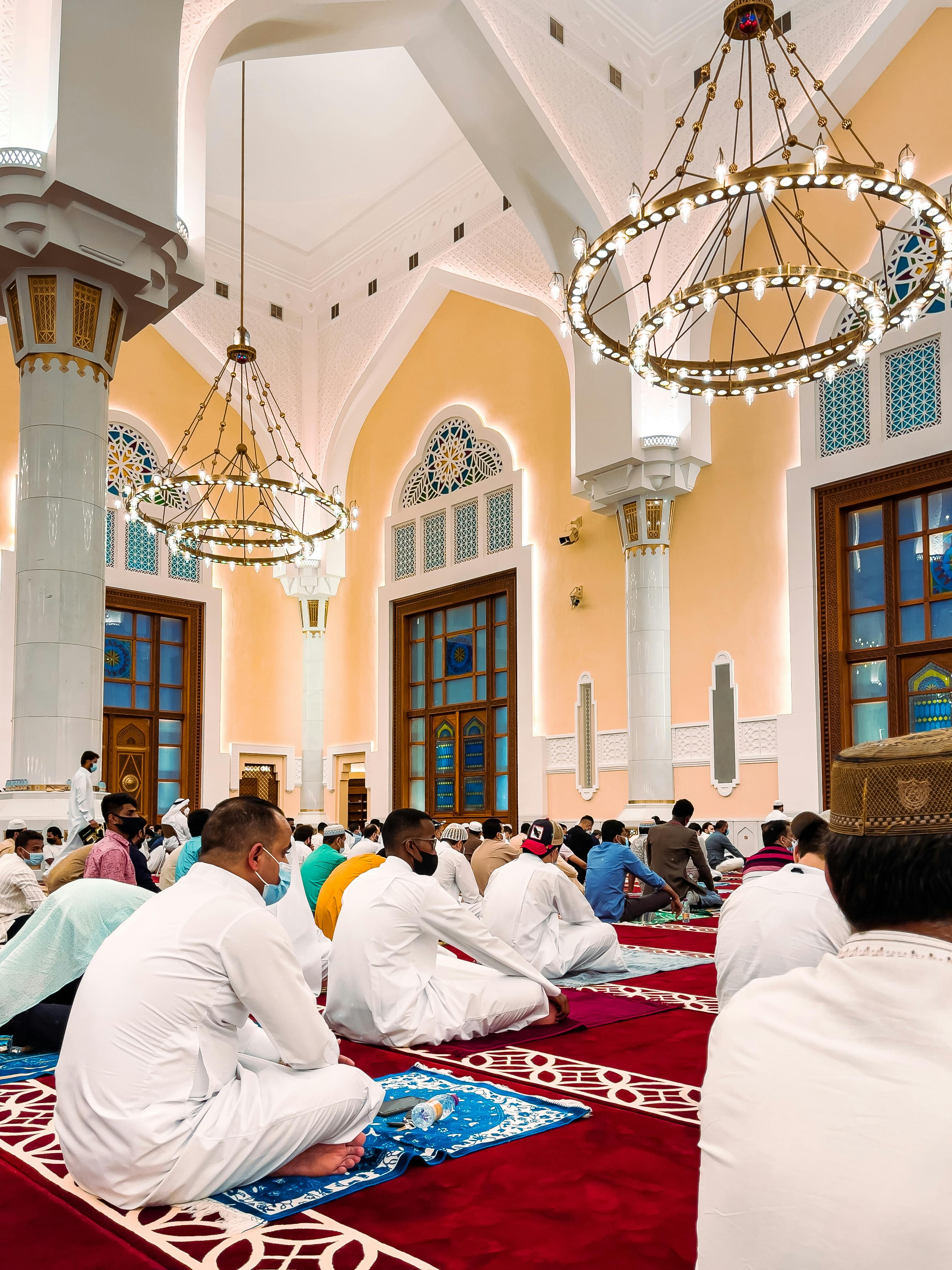 A Group of Men Sitting Inside a Mosque · Free Stock Photo