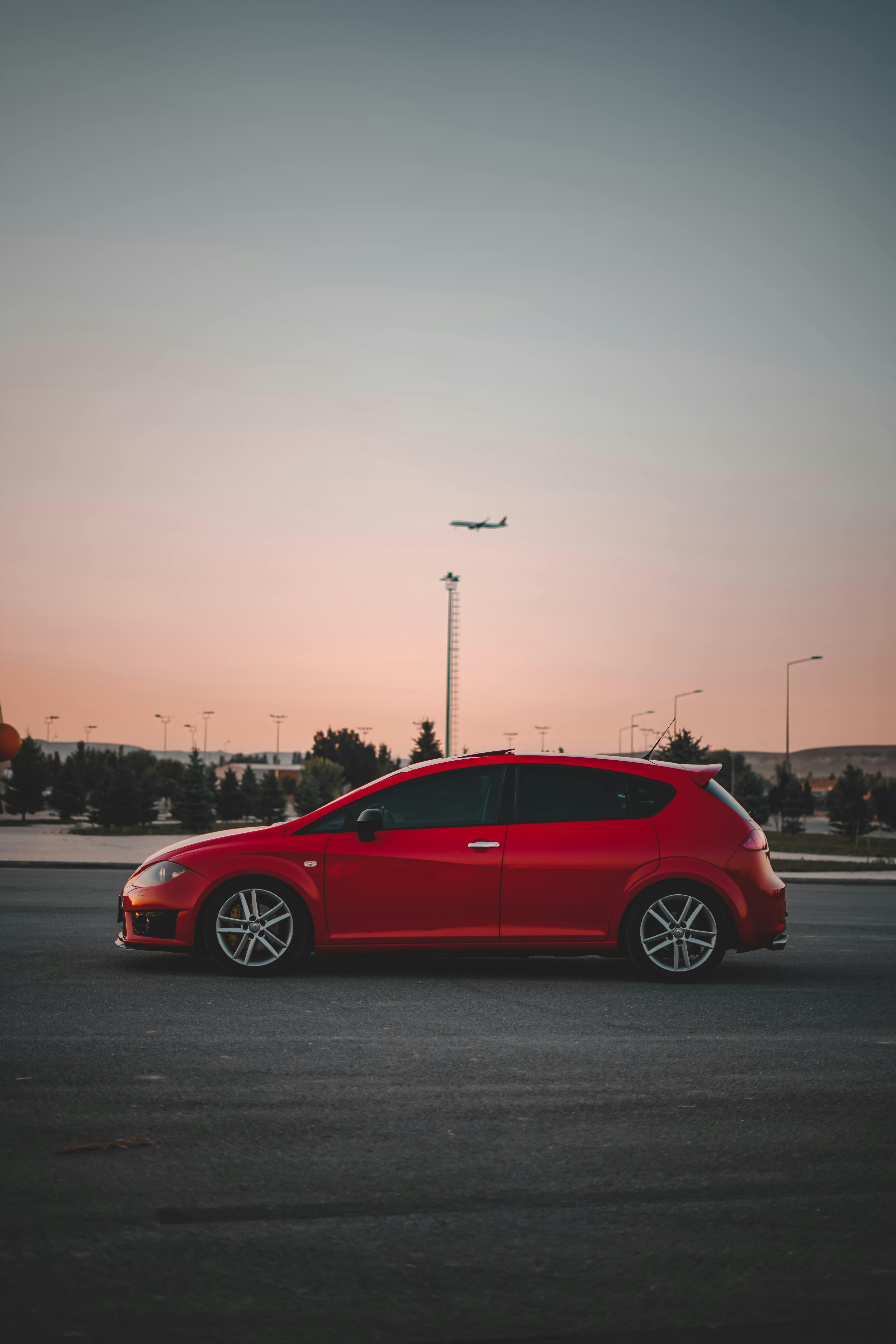 A Red Car on a Road · Free Stock Photo