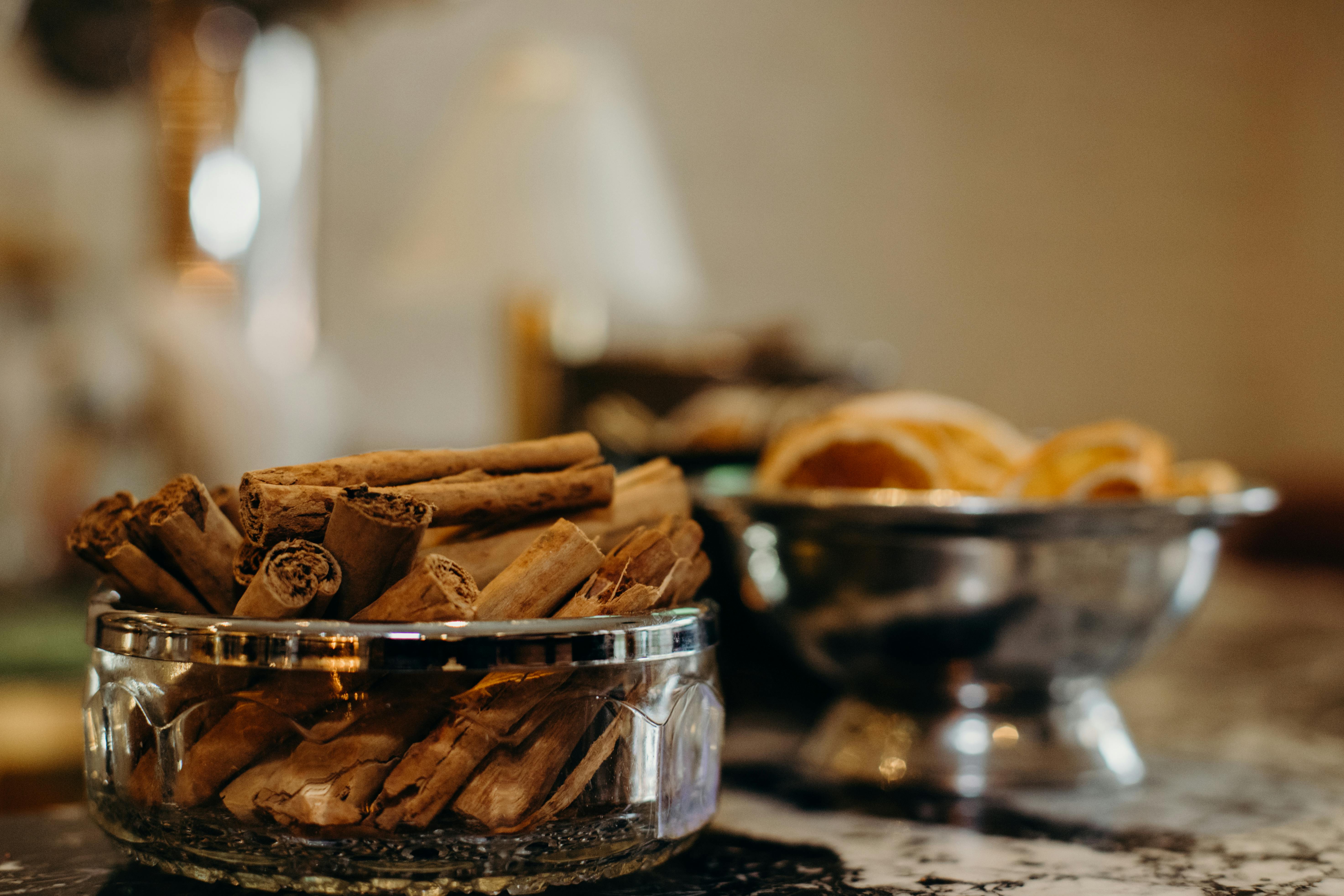 Brown Cinnamon Sticks on Clear Glass Container · Free Stock Photo