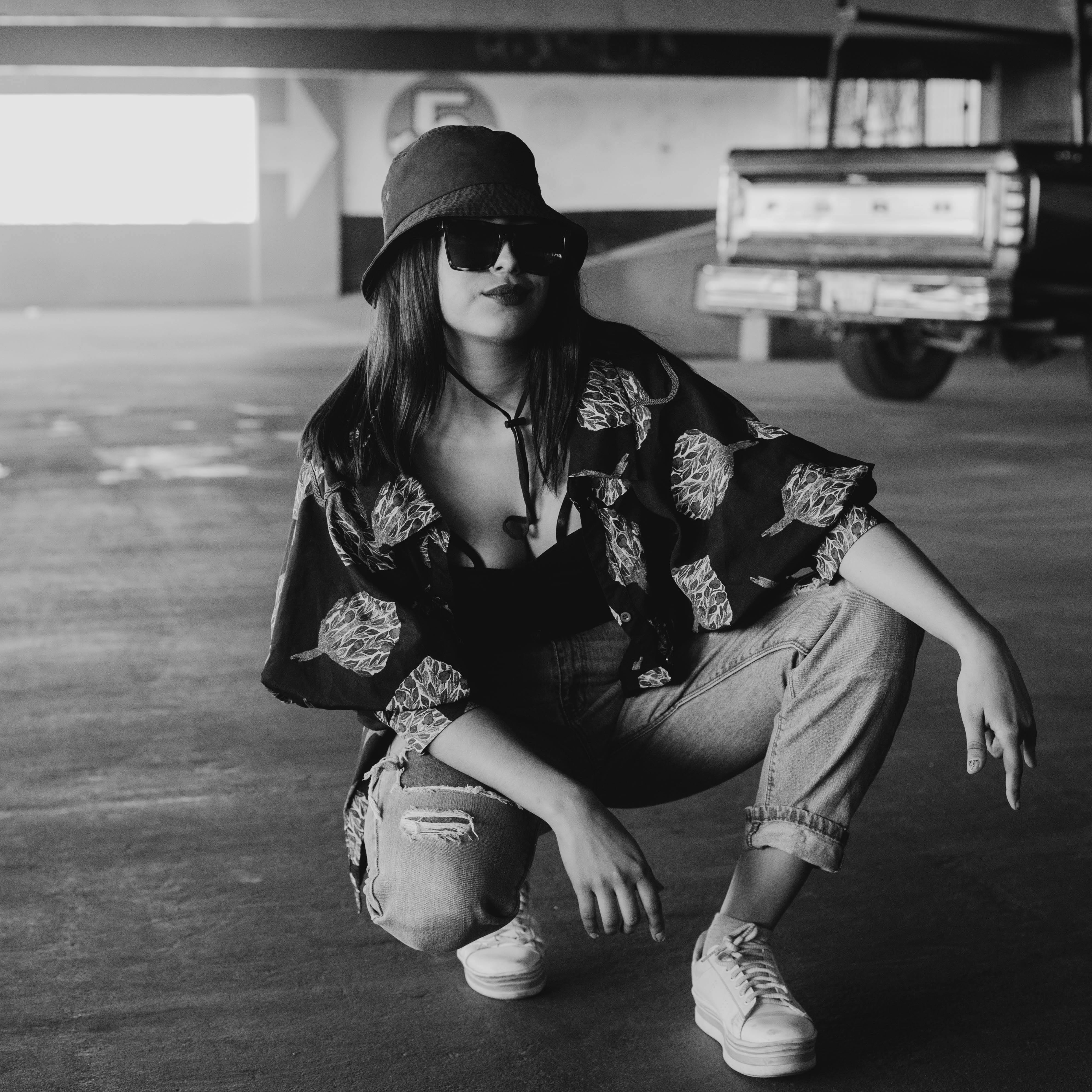 Young Woman Posing Crouching and Bending Backwards · Free Stock Photo