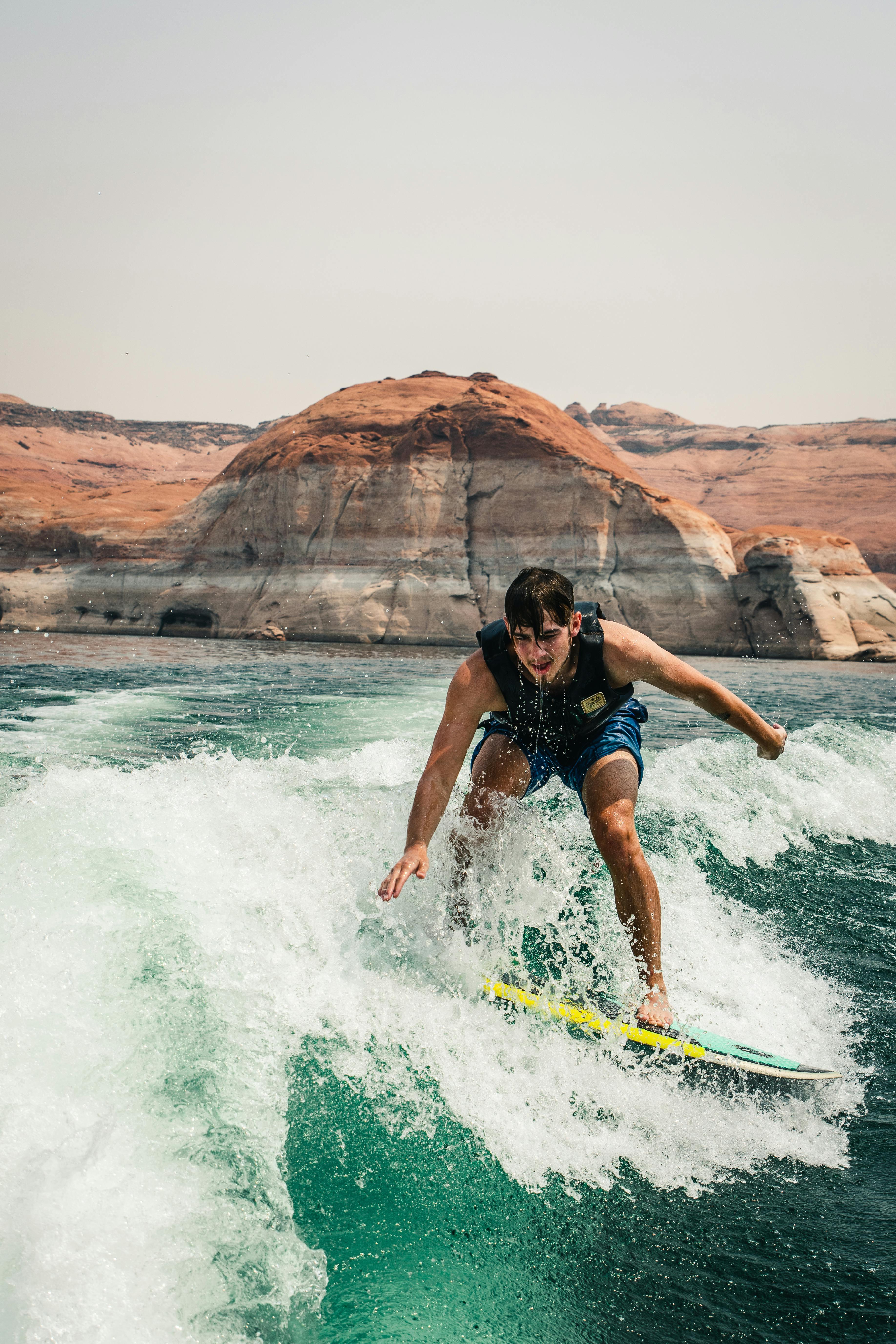 Water Dripping on a Surfer's Face while Surfing · Free Stock Photo