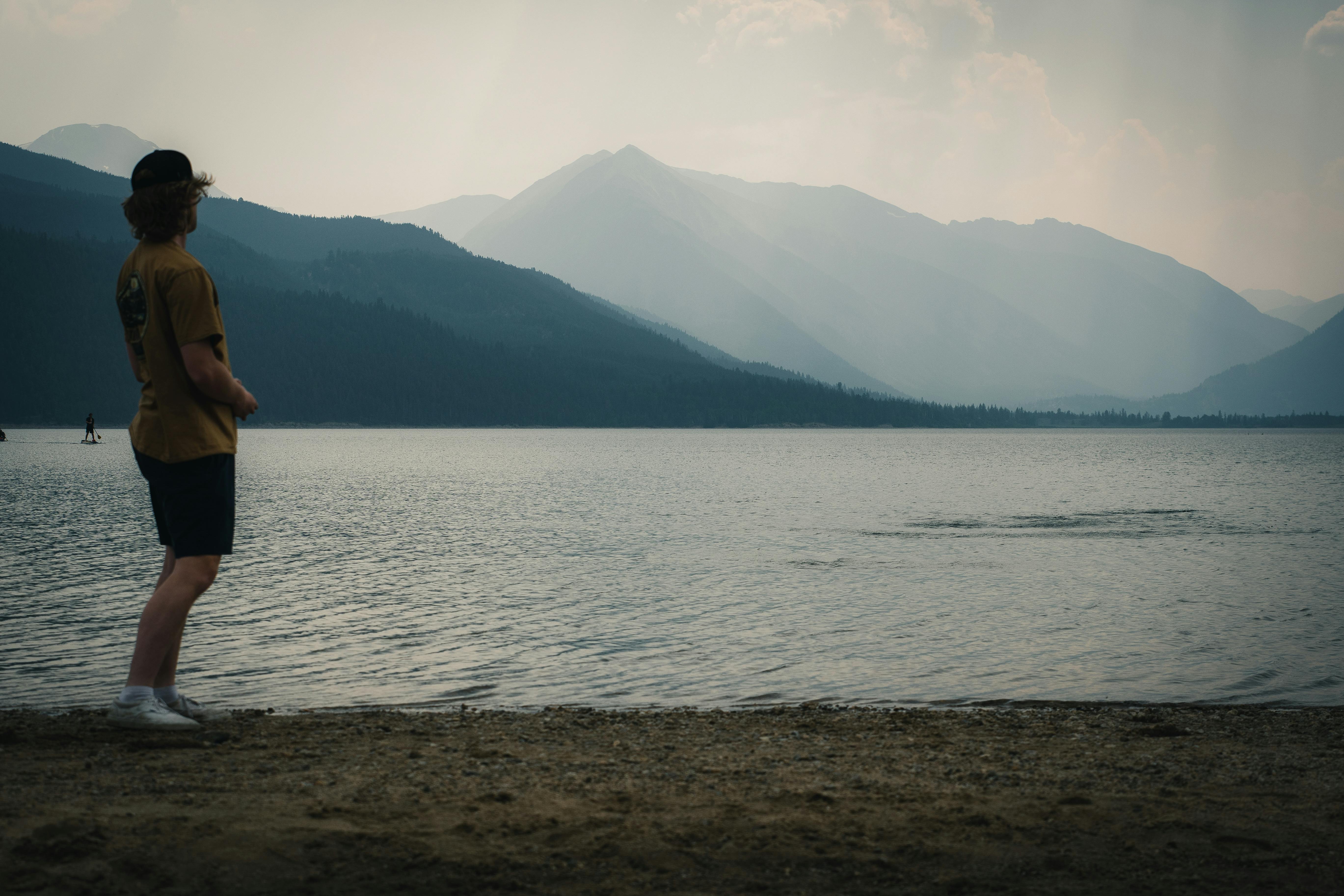 A Man Standing and Looking at the Sea · Free Stock Photo