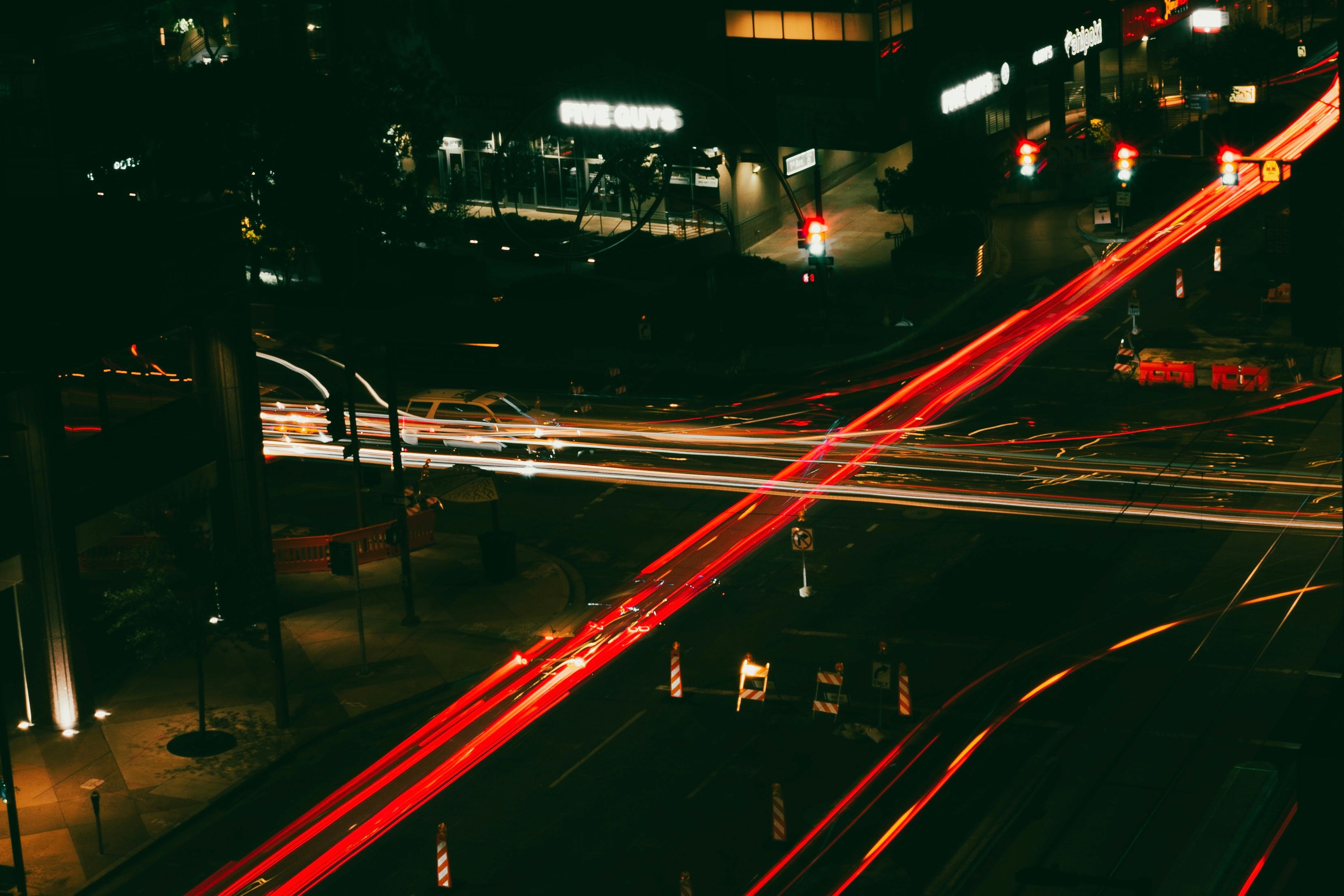 Time Lapse Photography of Cars on City Street near Concrete Buildings ...