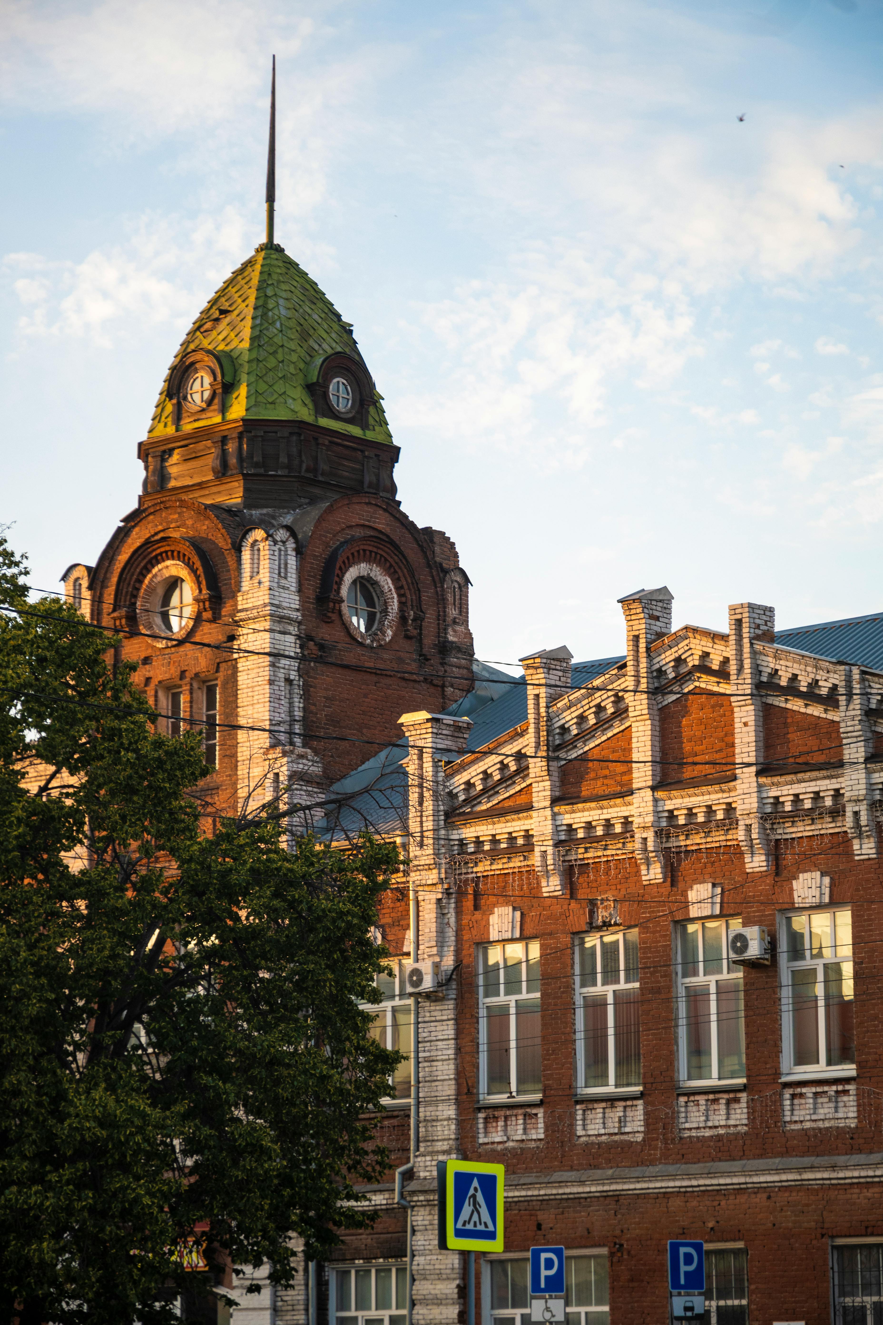 Old Brick City Building against Blue Sky · Free Stock Photo