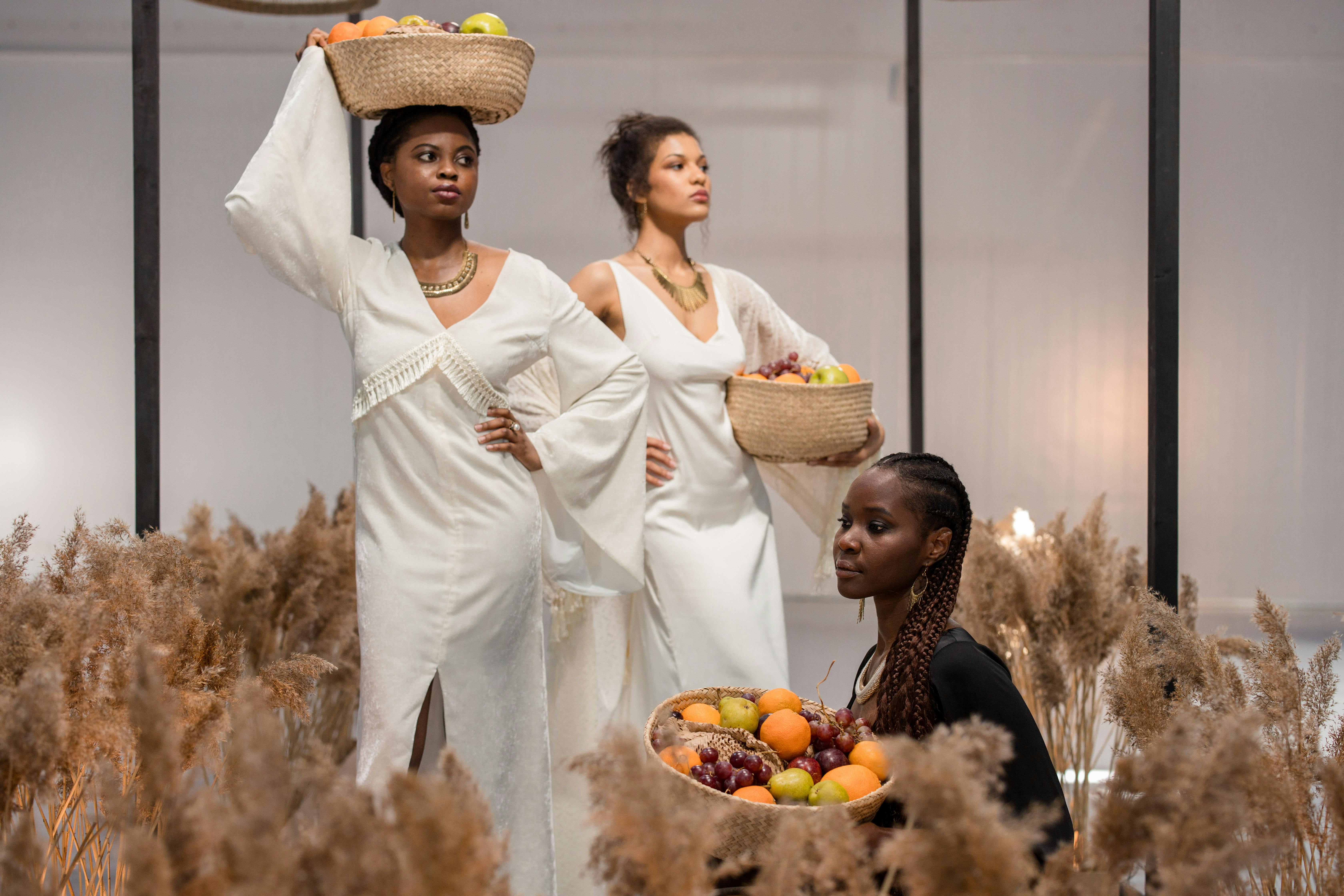 Models Posing with Apples on Their Heads · Free Stock Photo