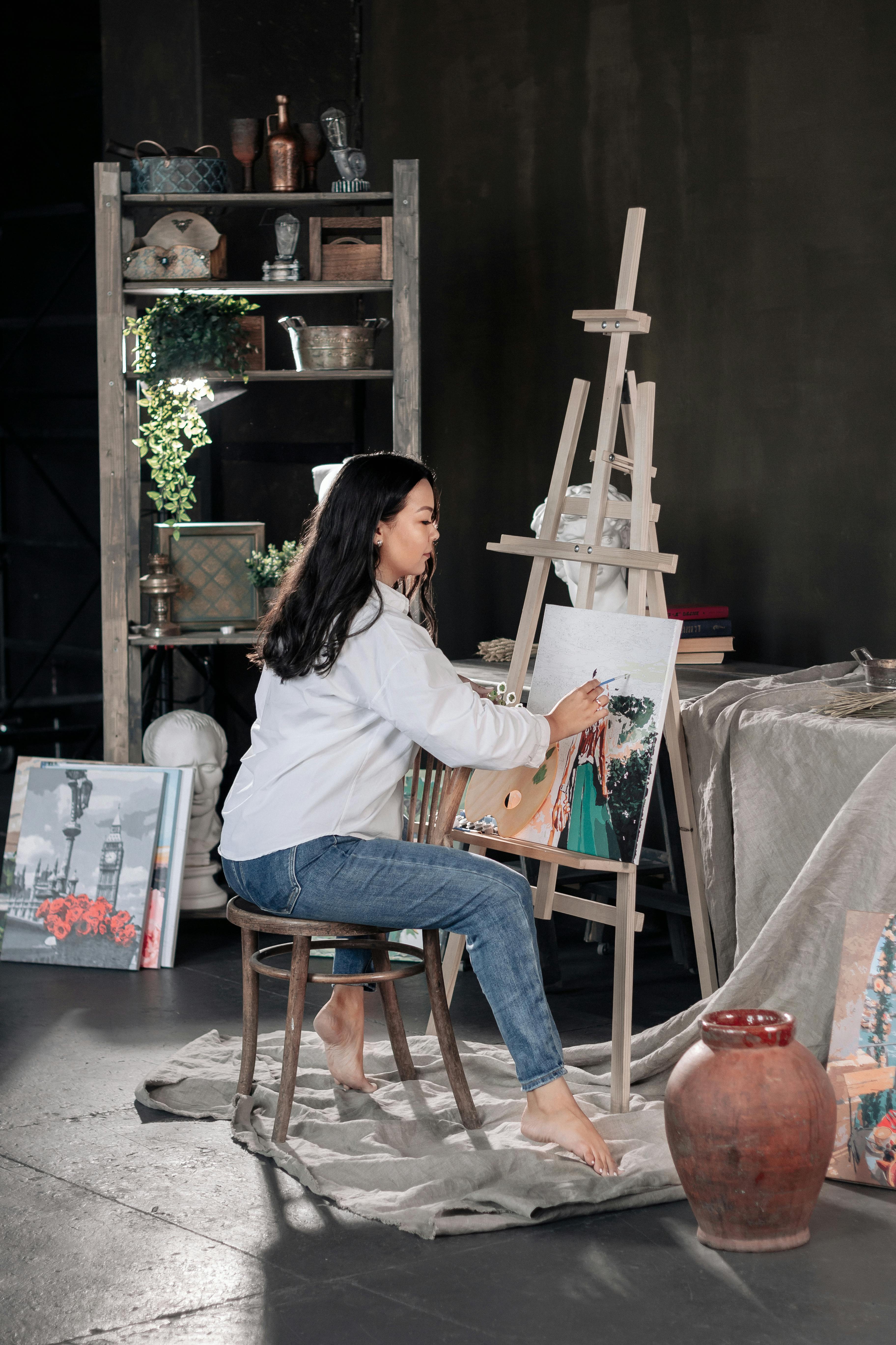 Woman Sitting and Painting · Free Stock Photo