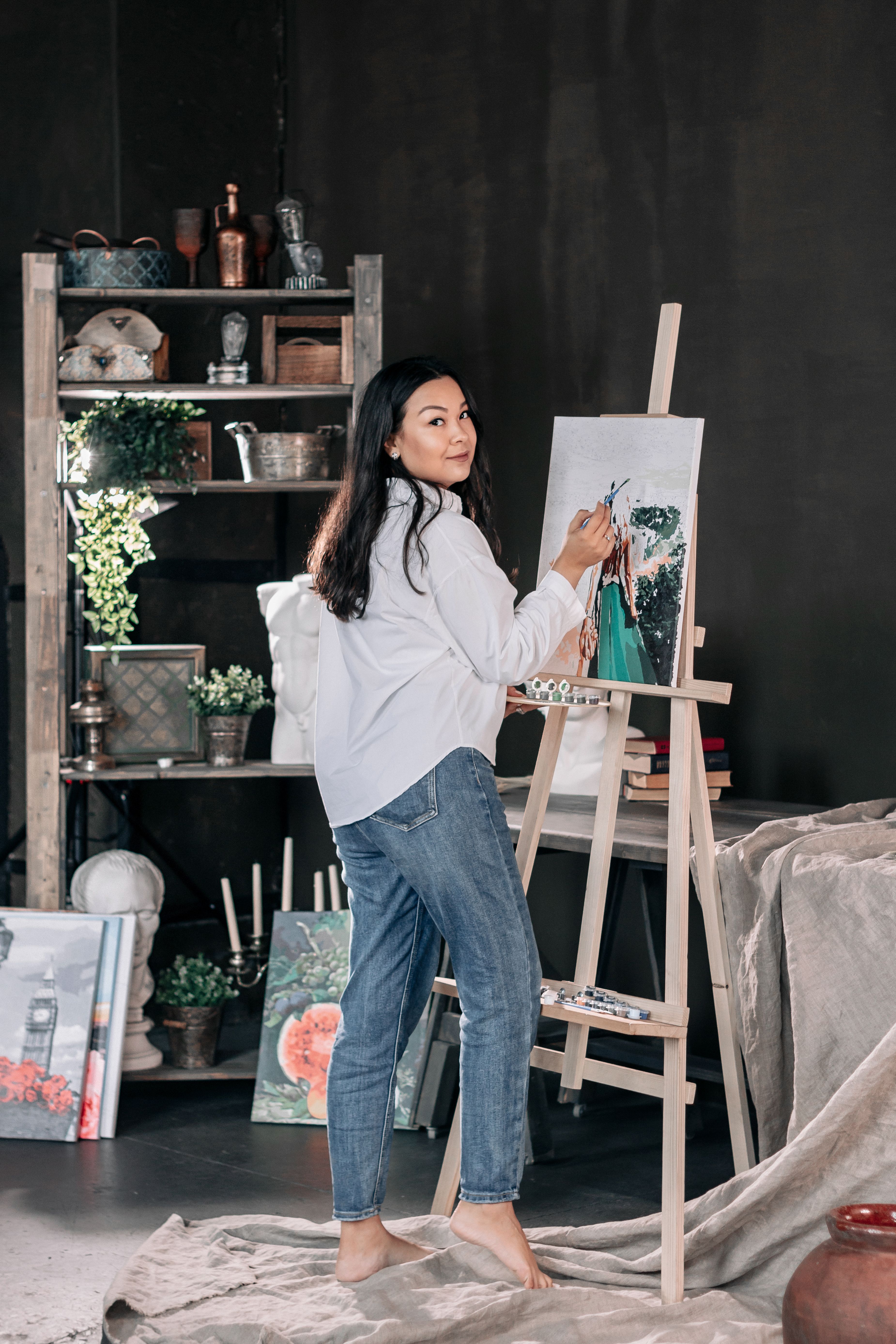 Woman Painting on Canvas in a Studio · Free Stock Photo